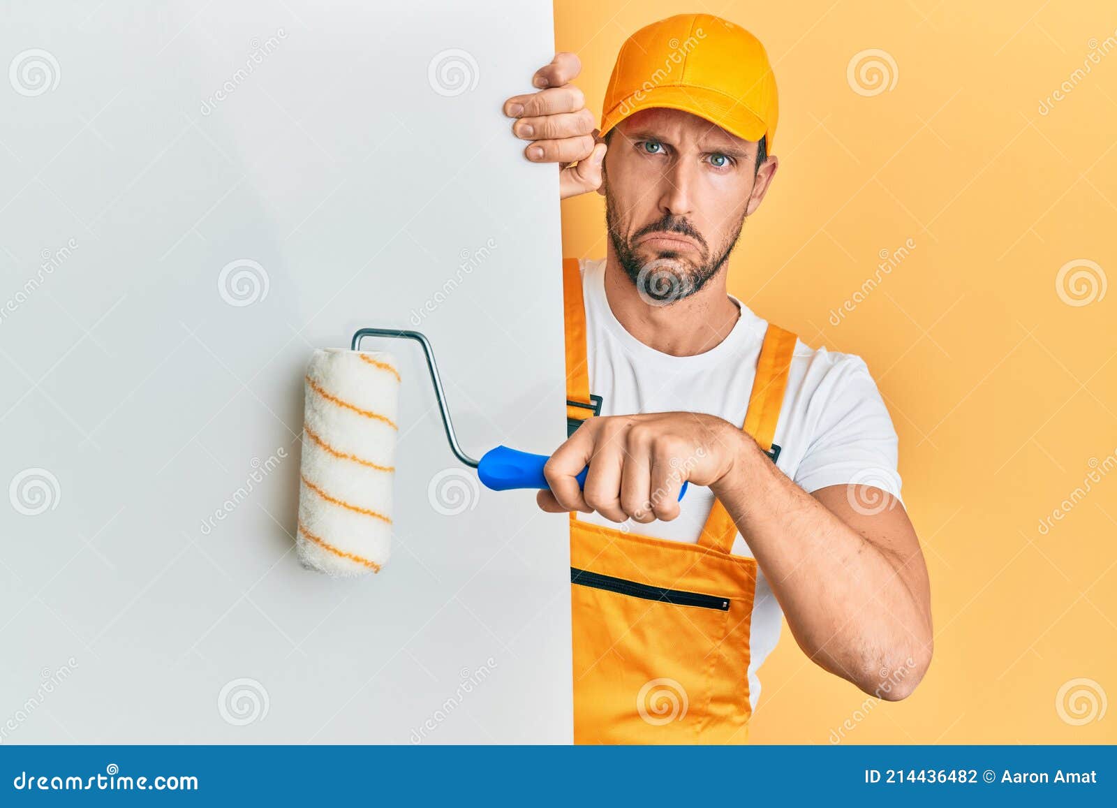 Young Handsome Man Holding Roller Painter Over White Banner Depressed ...