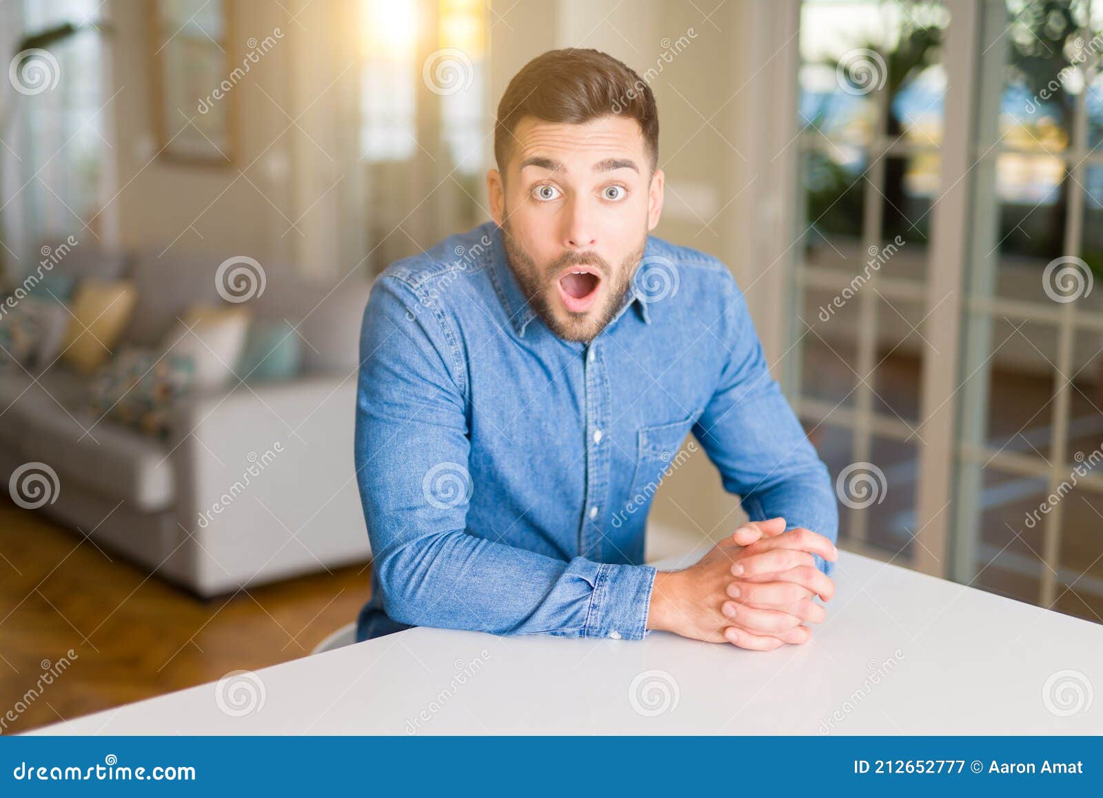 Young Handsome Man at Home Scared in Shock with a Surprise Face, Afraid ...