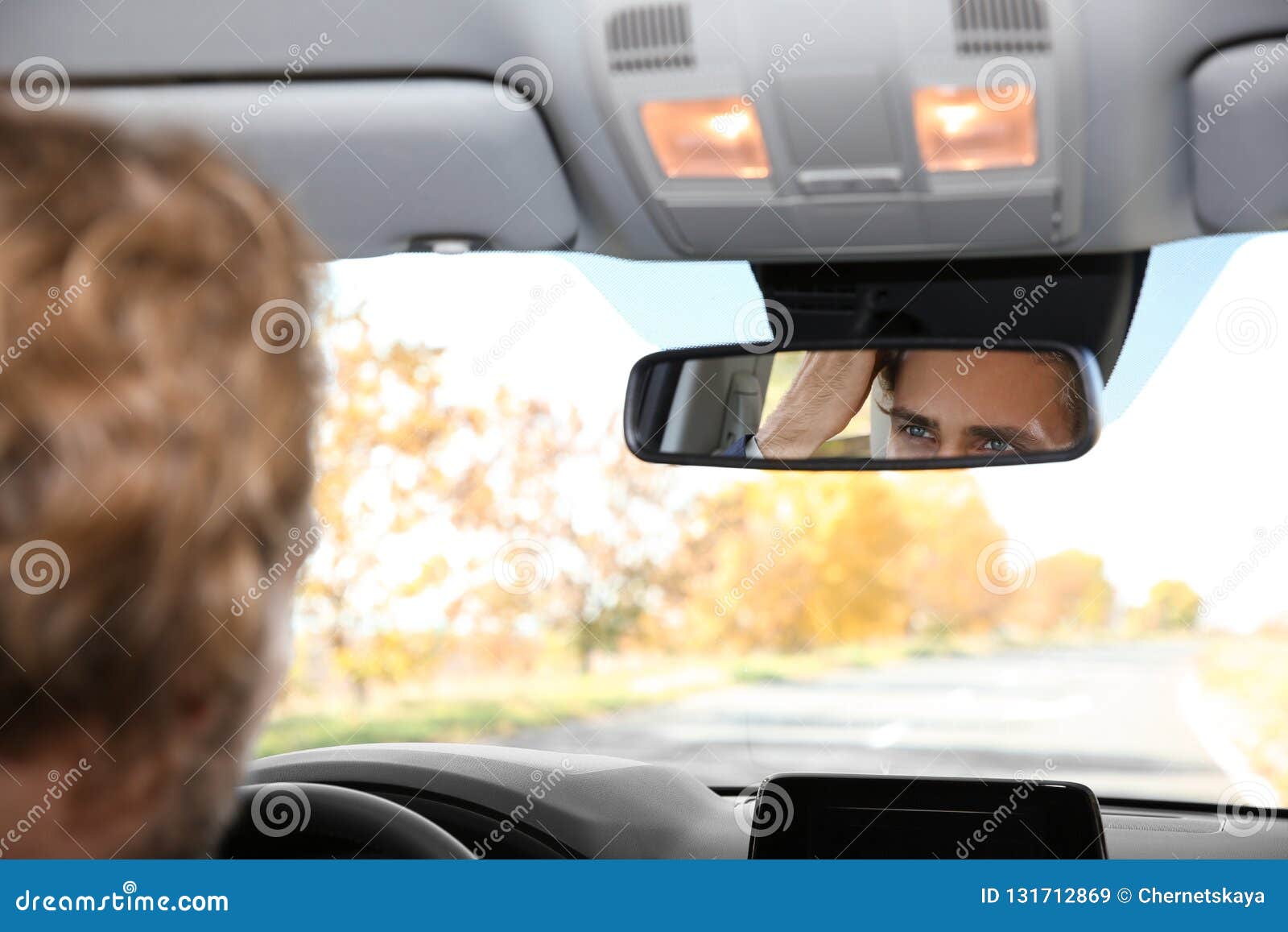 Young Handsome Man Looking into Interior Mirror Stock Image - Image of ...