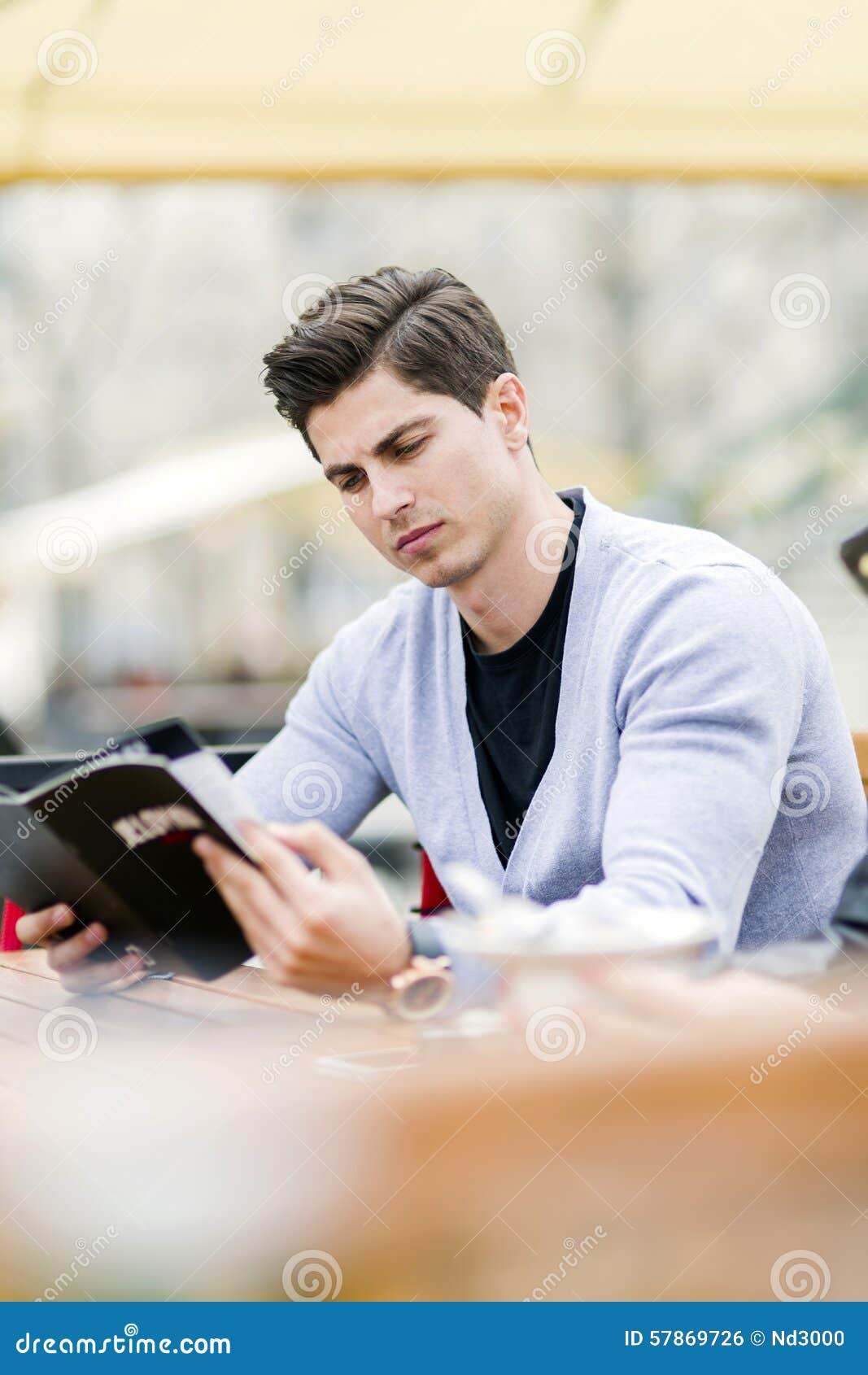 Young Handsome Man Looking at the Menu Stock Photo - Image of hungry ...