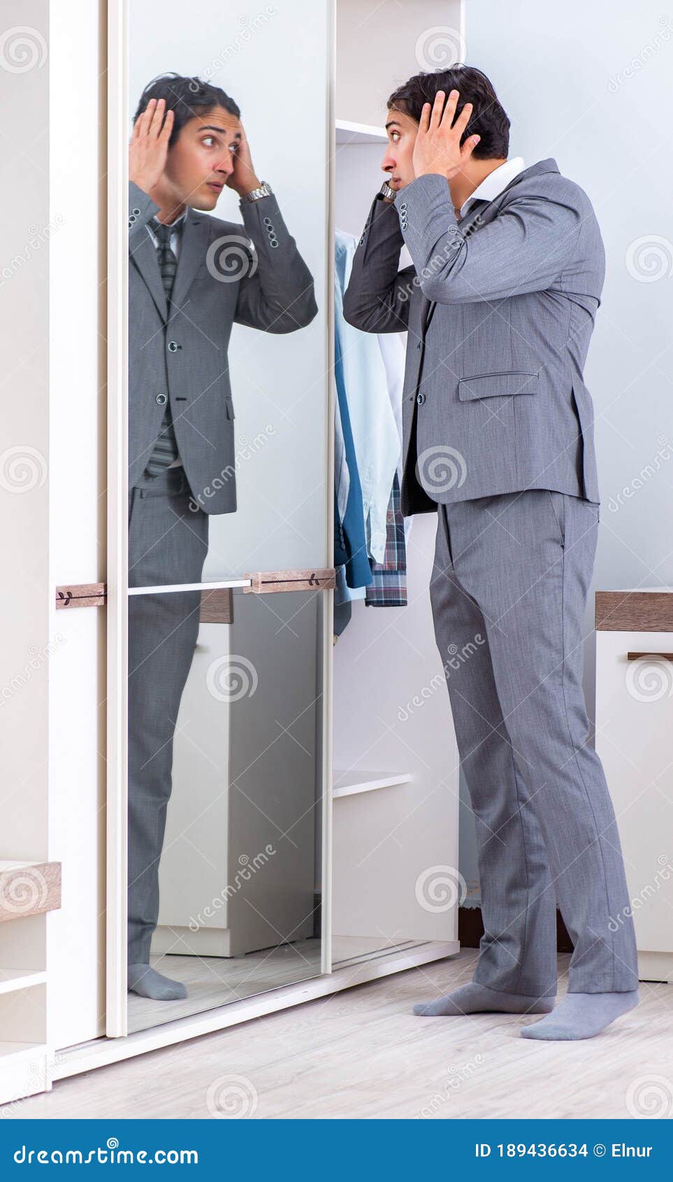 Young Handsome Man Looking at the Mirror Stock Photo - Image of clothes ...