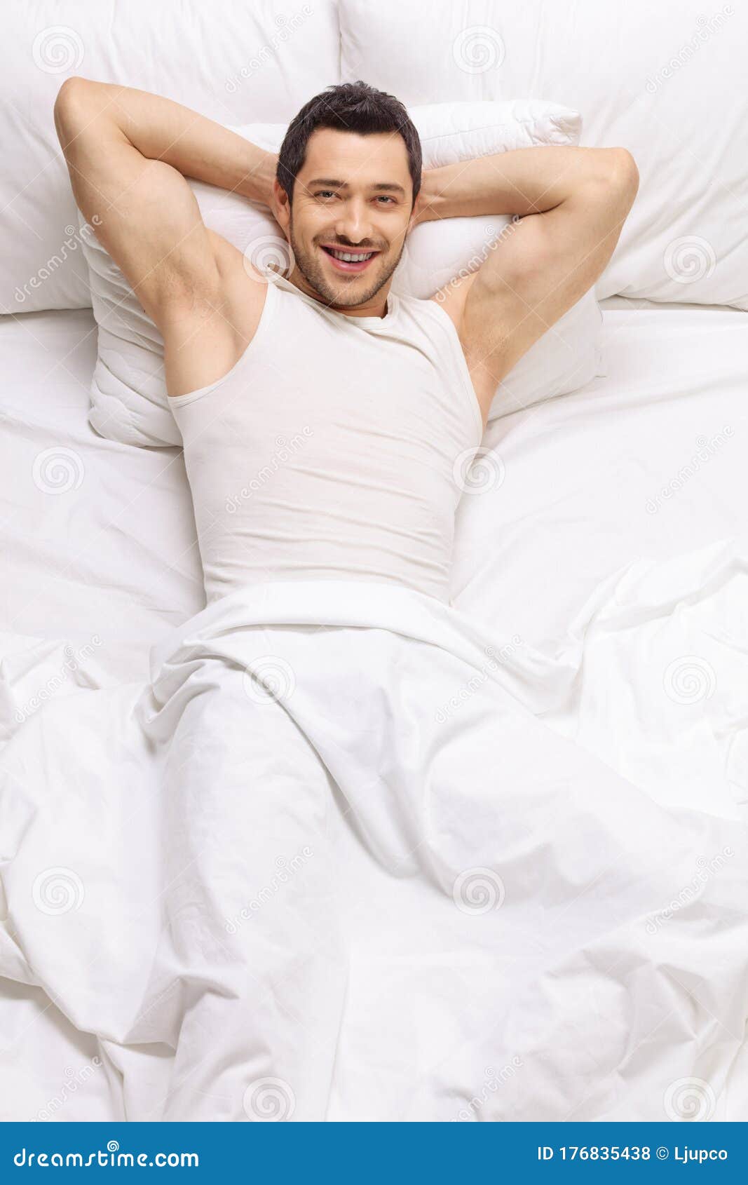 Young Handsome Man Lying in a Bed Under Stock Photo - Image of leisure ...