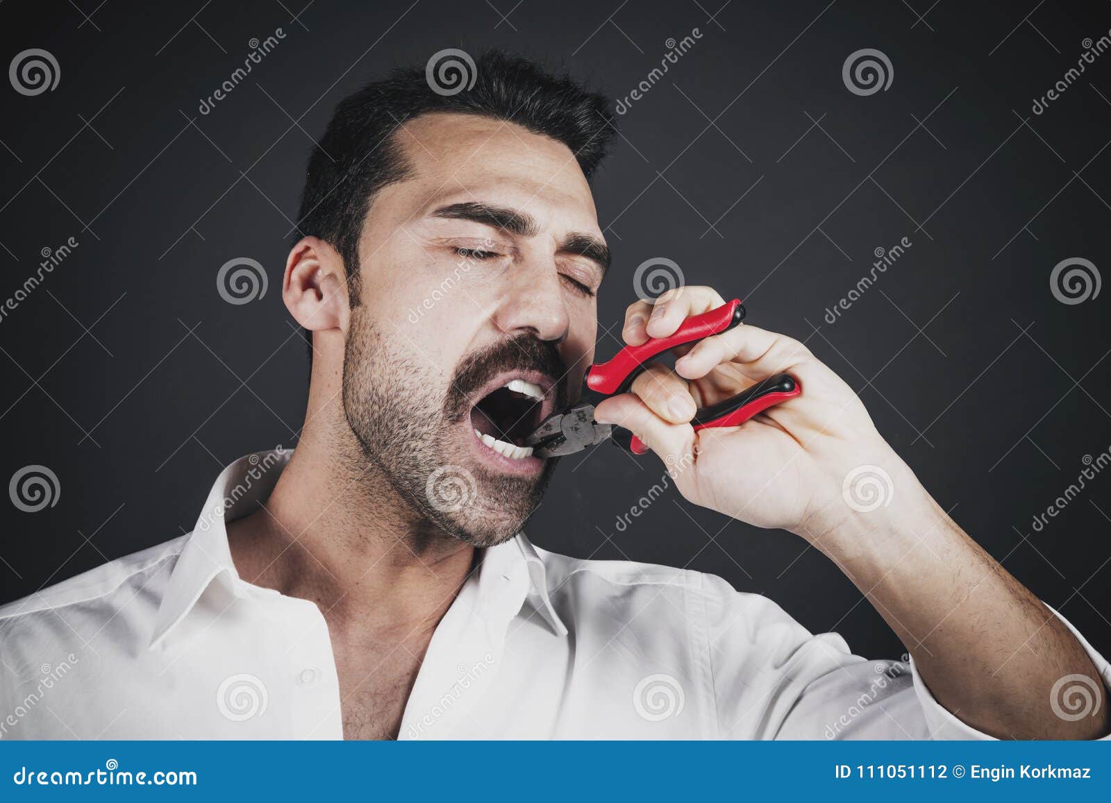 Young Handsome Man Pulling Out His Tooth Stock Photo - Image of dentist ...