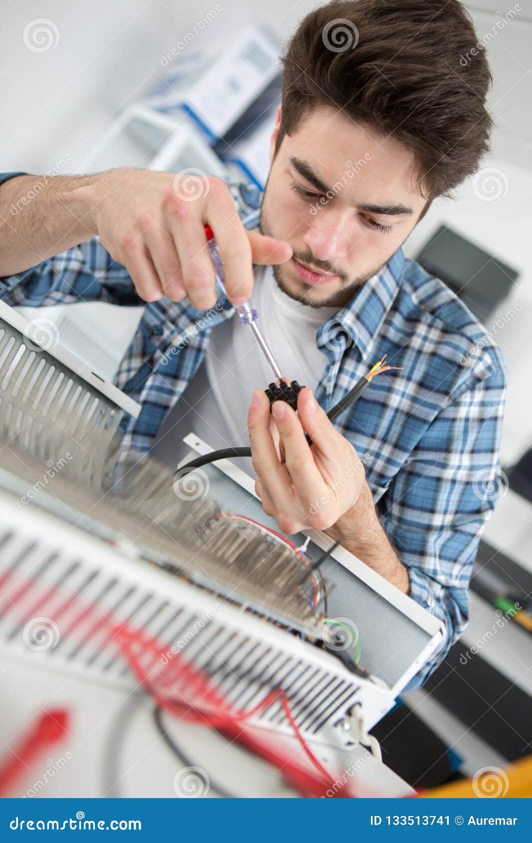 Young Handsome Man Repairing Radiator Stock Image - Image of labor ...