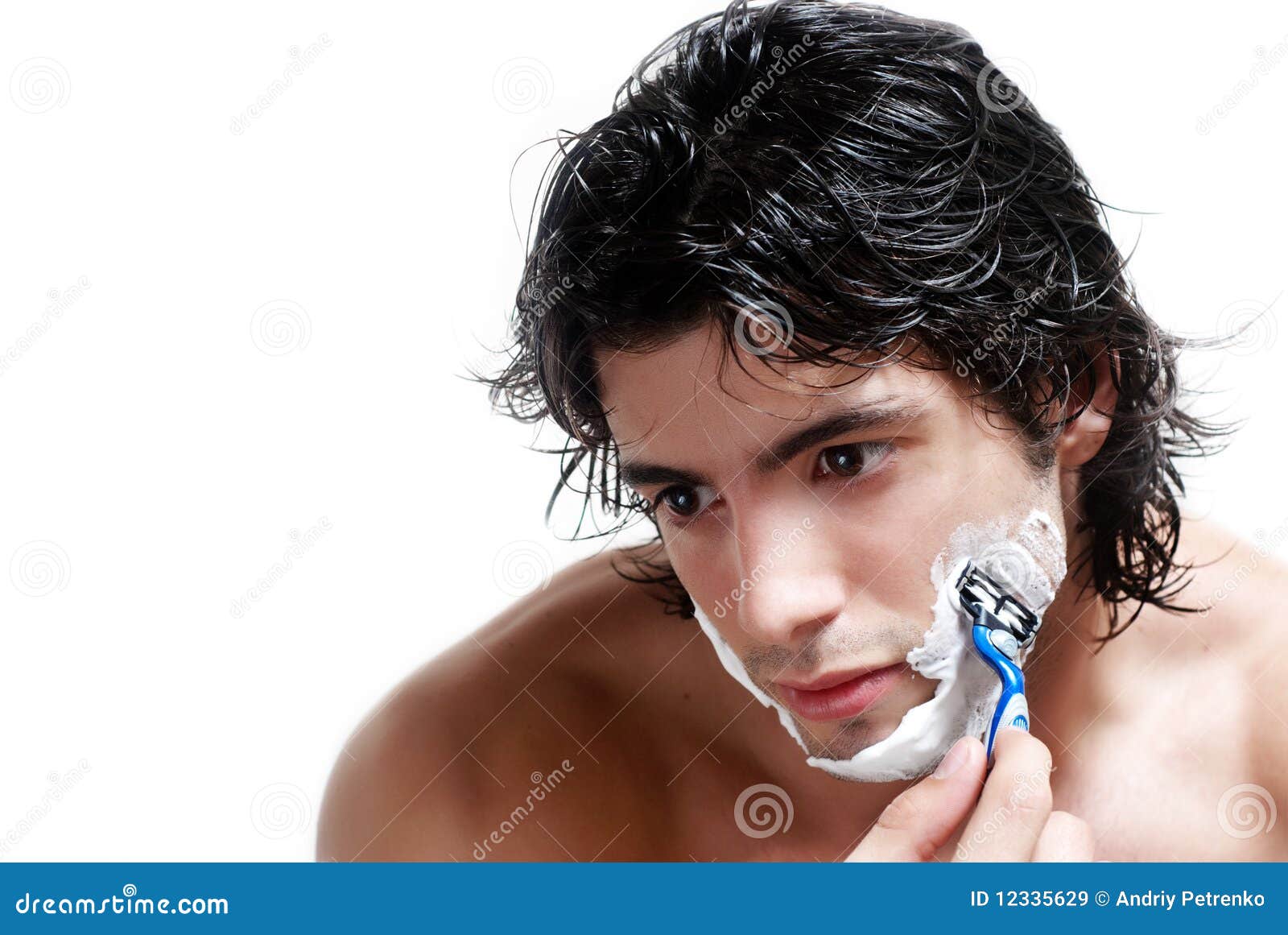 Young handsome man shaving stock image. Image of eyes - 12335629