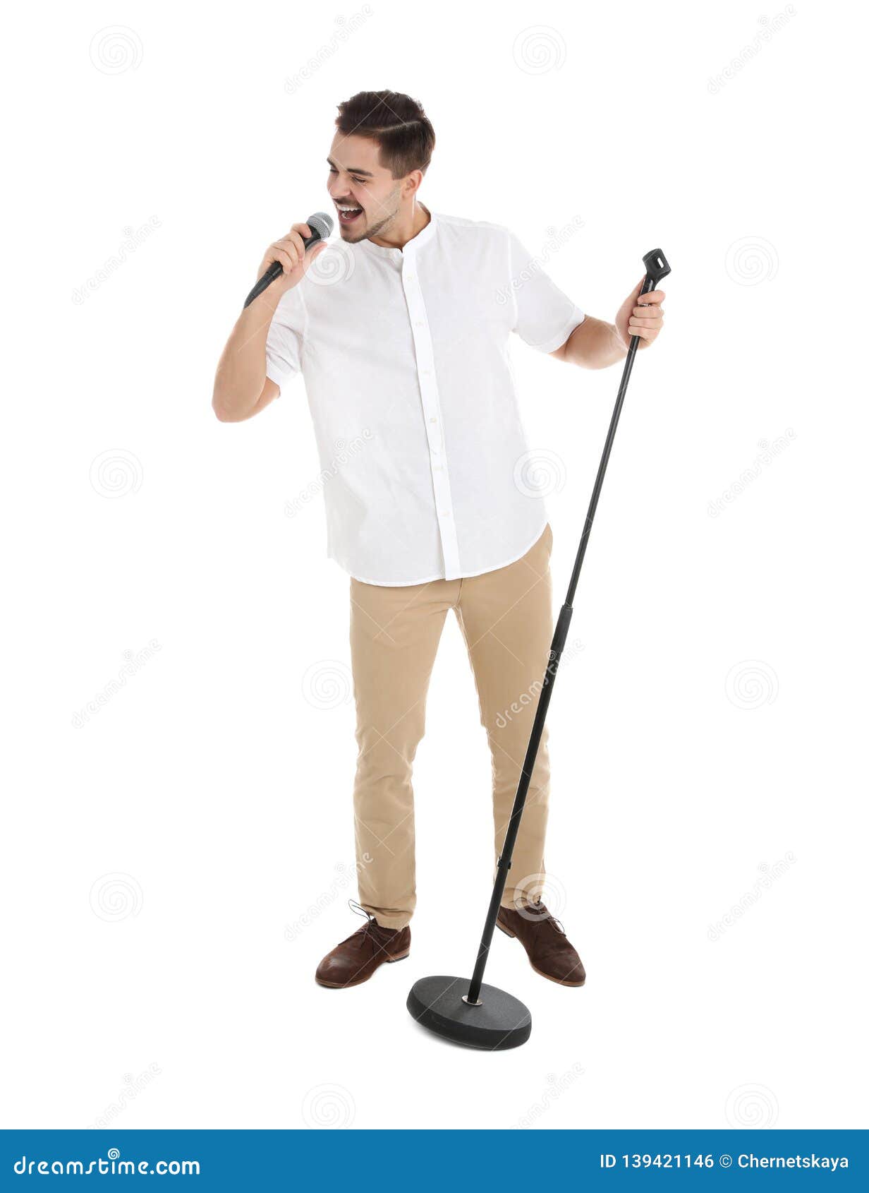 Young Handsome Man Singing in Microphone Stock Photo - Image of singing ...