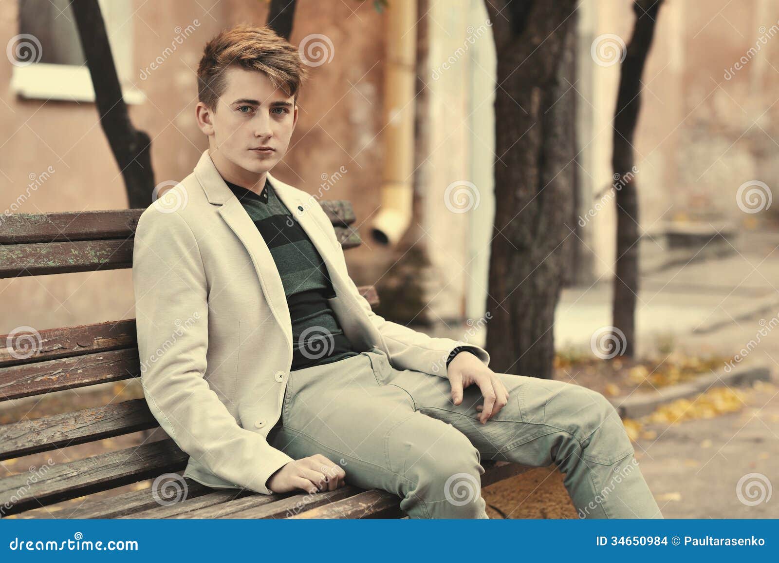 Young Handsome Man Sitting on a Bench Stock Photo - Image of attractive ...