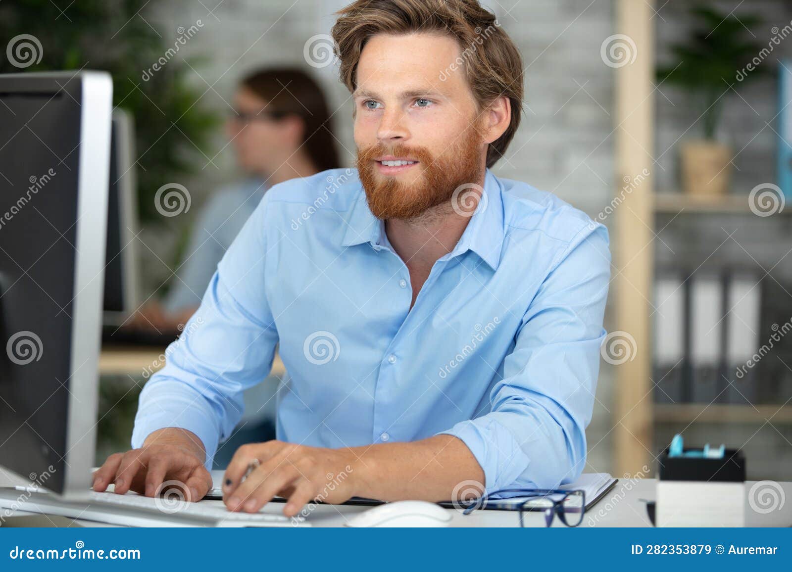 Young Handsome Man Sitting at Desk in Office Stock Image - Image of ...