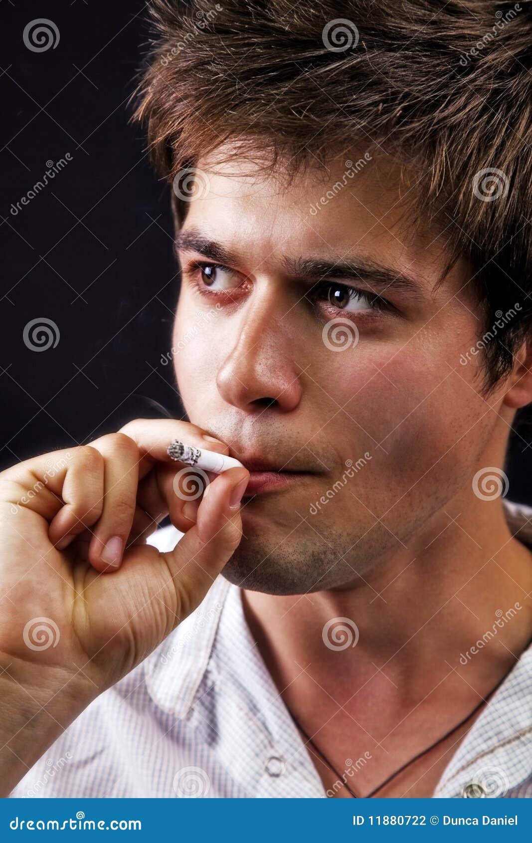 Young handsome man smoking stock photo. Image of alone - 11880722