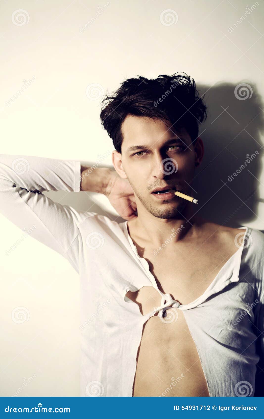 Young Handsome Man Smoking a Cigarette Stock Photo - Image of inhaling ...
