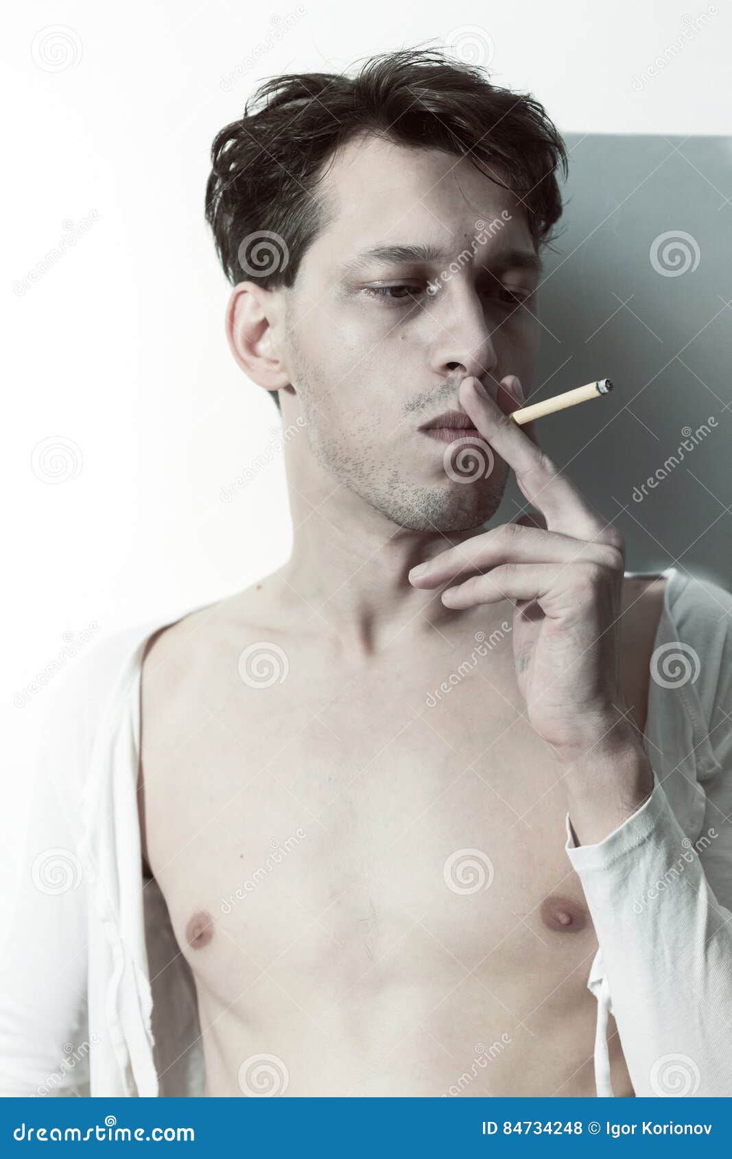 Young Handsome Man Smoking a Cigarette Stock Photo - Image of elegance ...