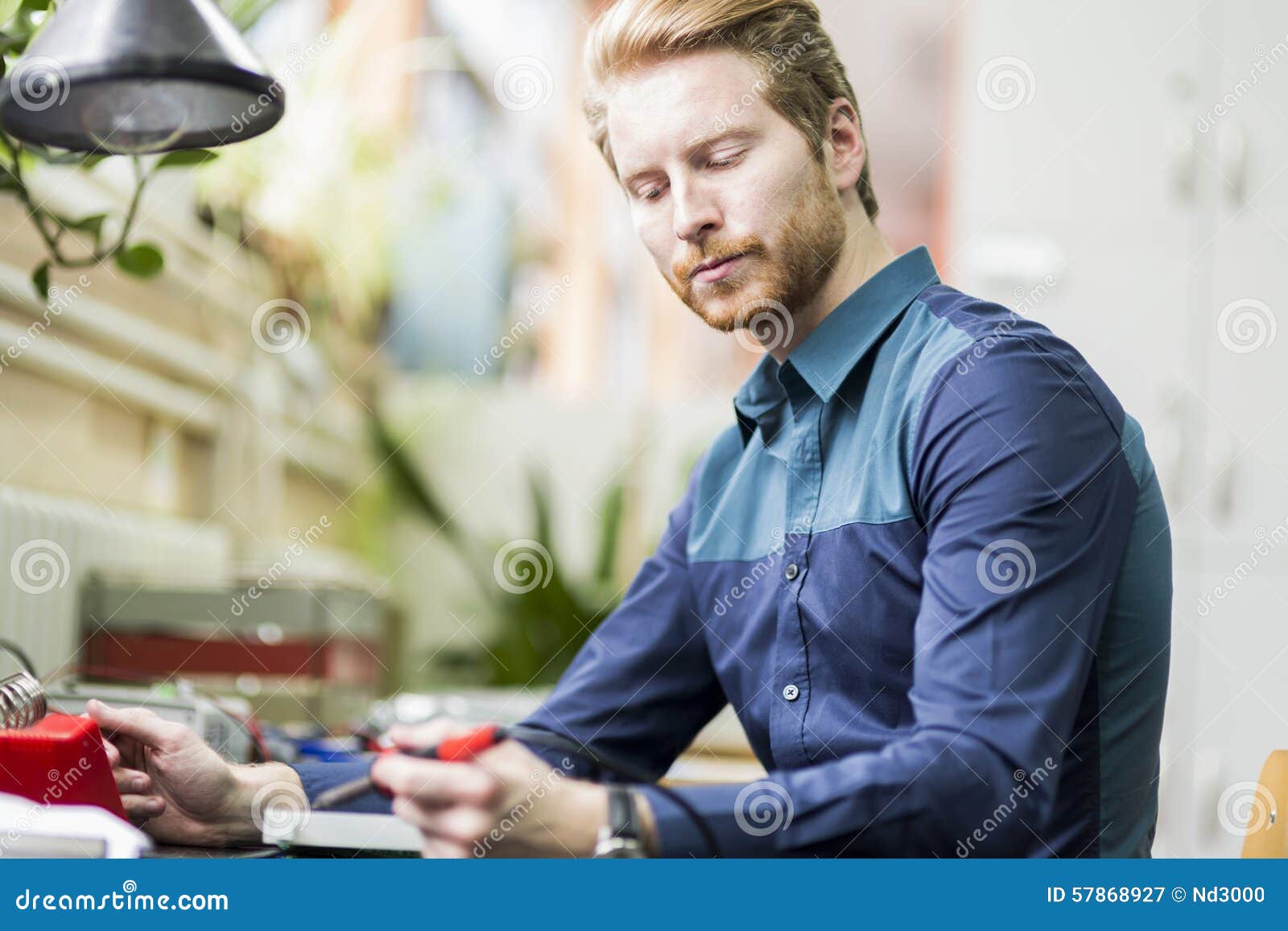 Young Handsome Man Soldering a Circuit Board Stock Image - Image of ...