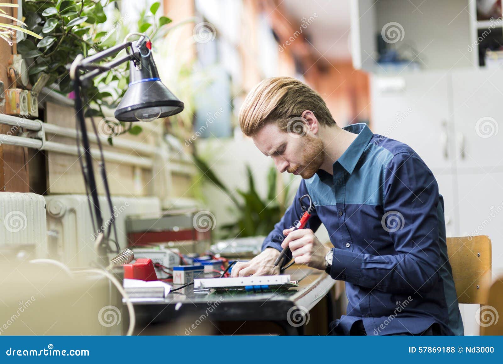 Young Handsome Man Soldering a Circuit Board Stock Photo - Image of ...
