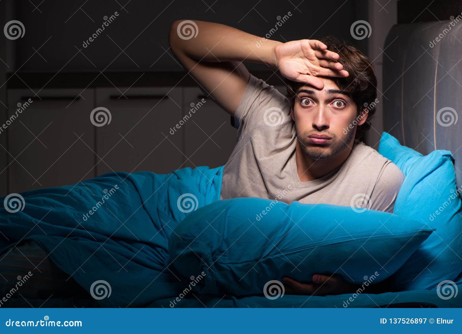 The Young Handsome Man Suffering from Insomnia in Bed Stock Image ...