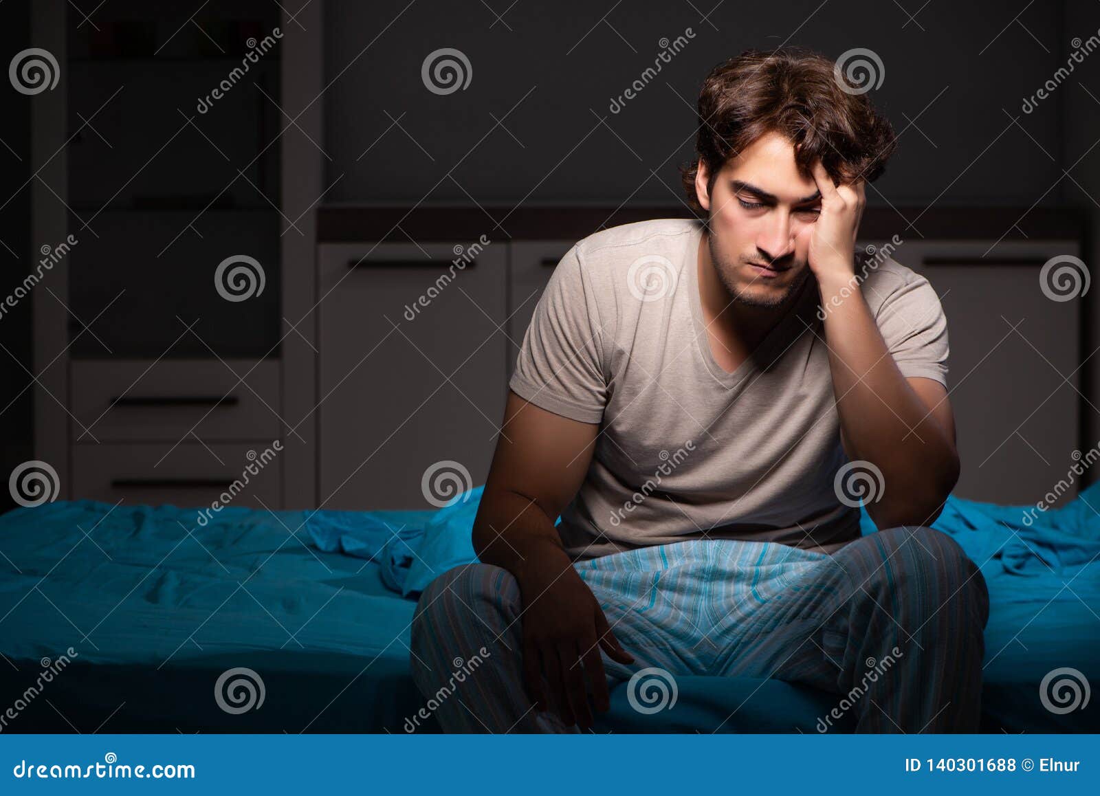 The Young Handsome Man Suffering from Insomnia in Bed Stock Photo ...