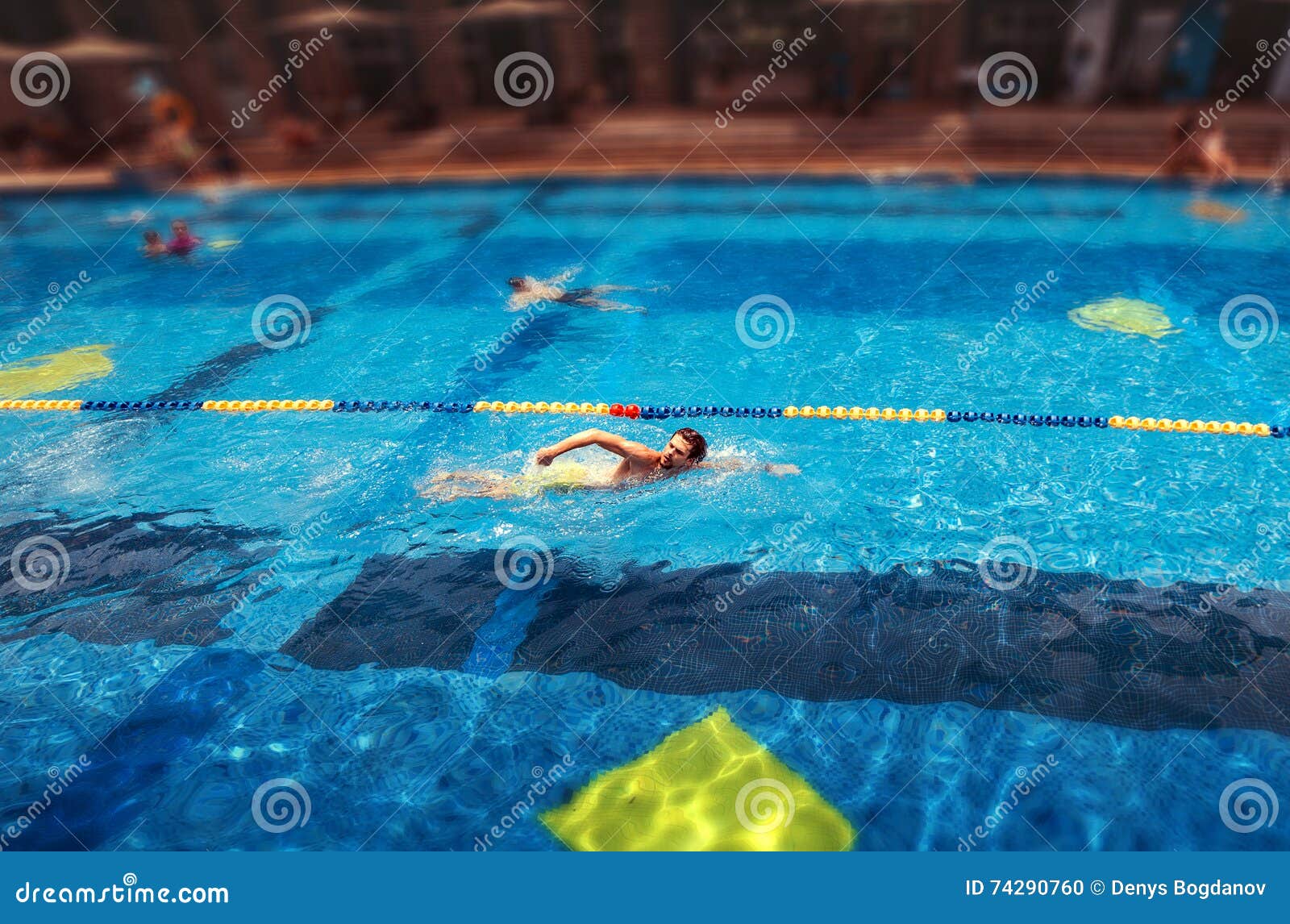 Young Handsome Man Swimming in the Pool. Stock Photo - Image of people ...