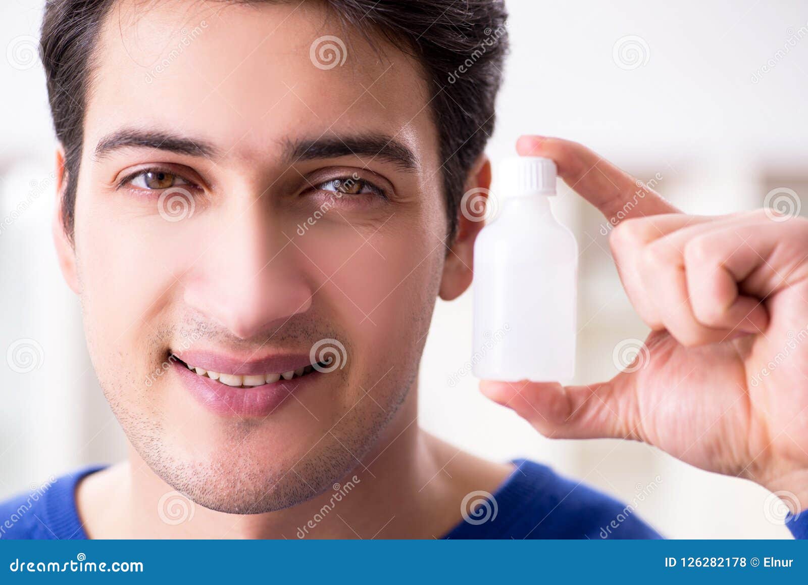 The Young Handsome Man Taking Care of Face Skin Stock Photo - Image of ...