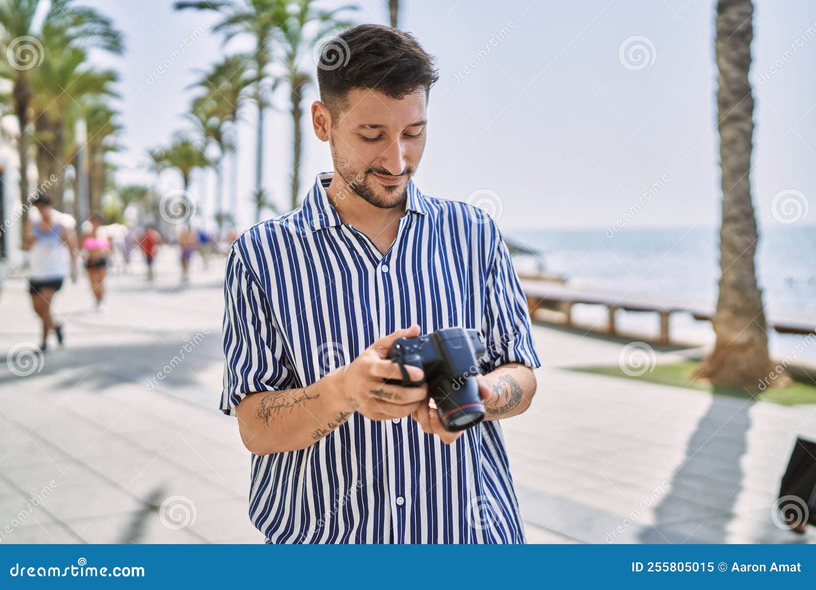 Young Handsome Man Using Dslr Photography Camera by the Sea Stock Image ...
