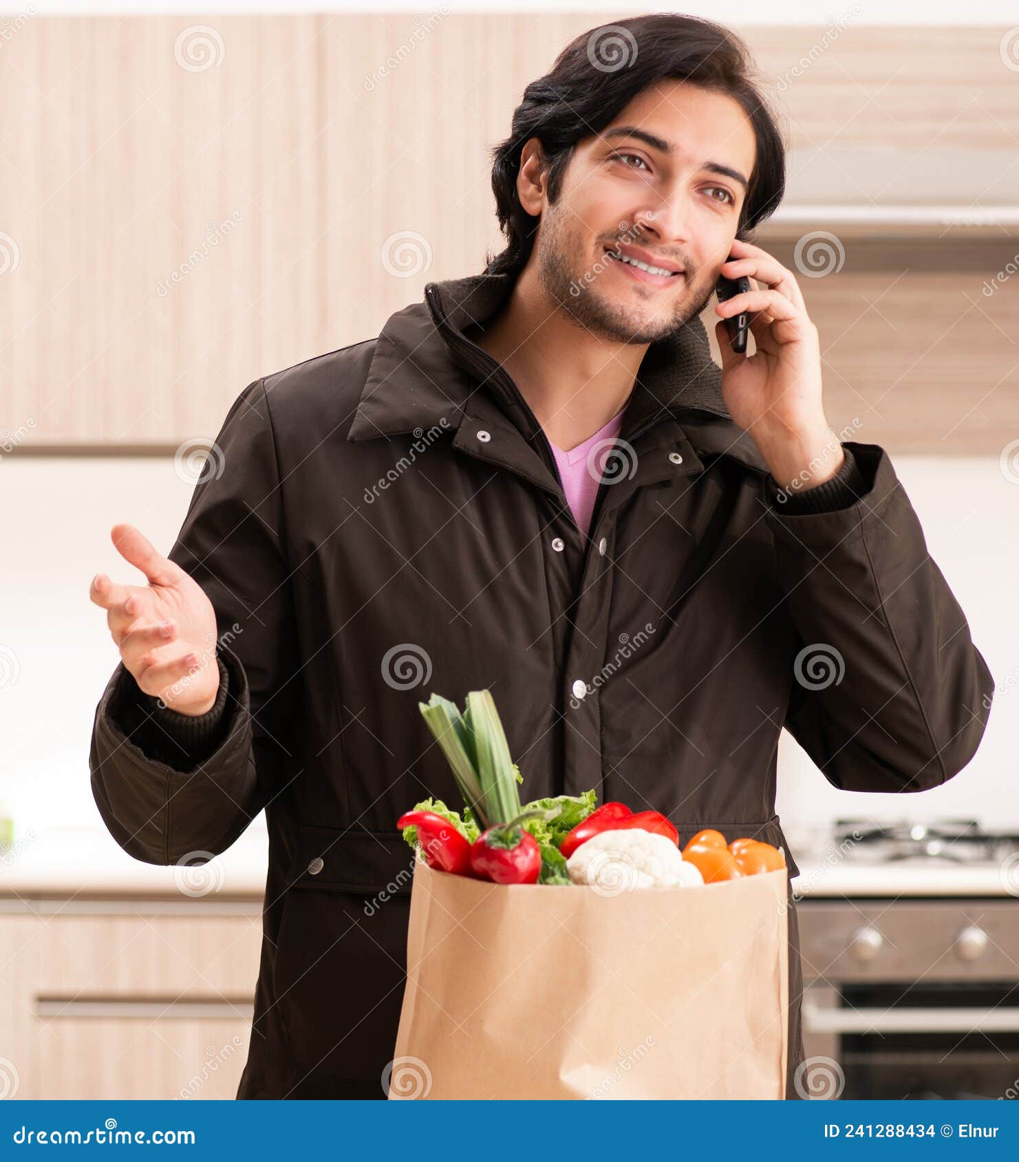 The Young Handsome Man with Vegetables in the Kitchen Stock Photo ...