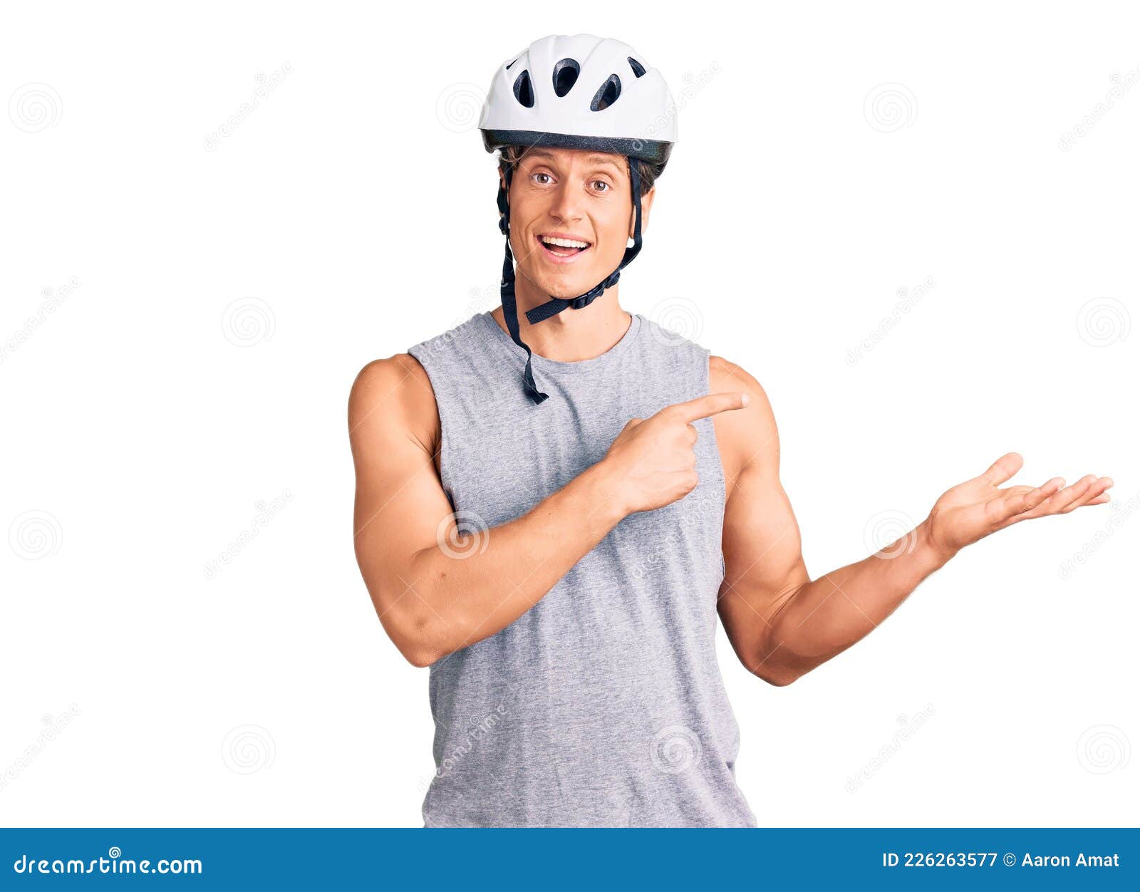 Young Handsome Man Wearing Bike Helmet Amazed And Smiling To The Camera