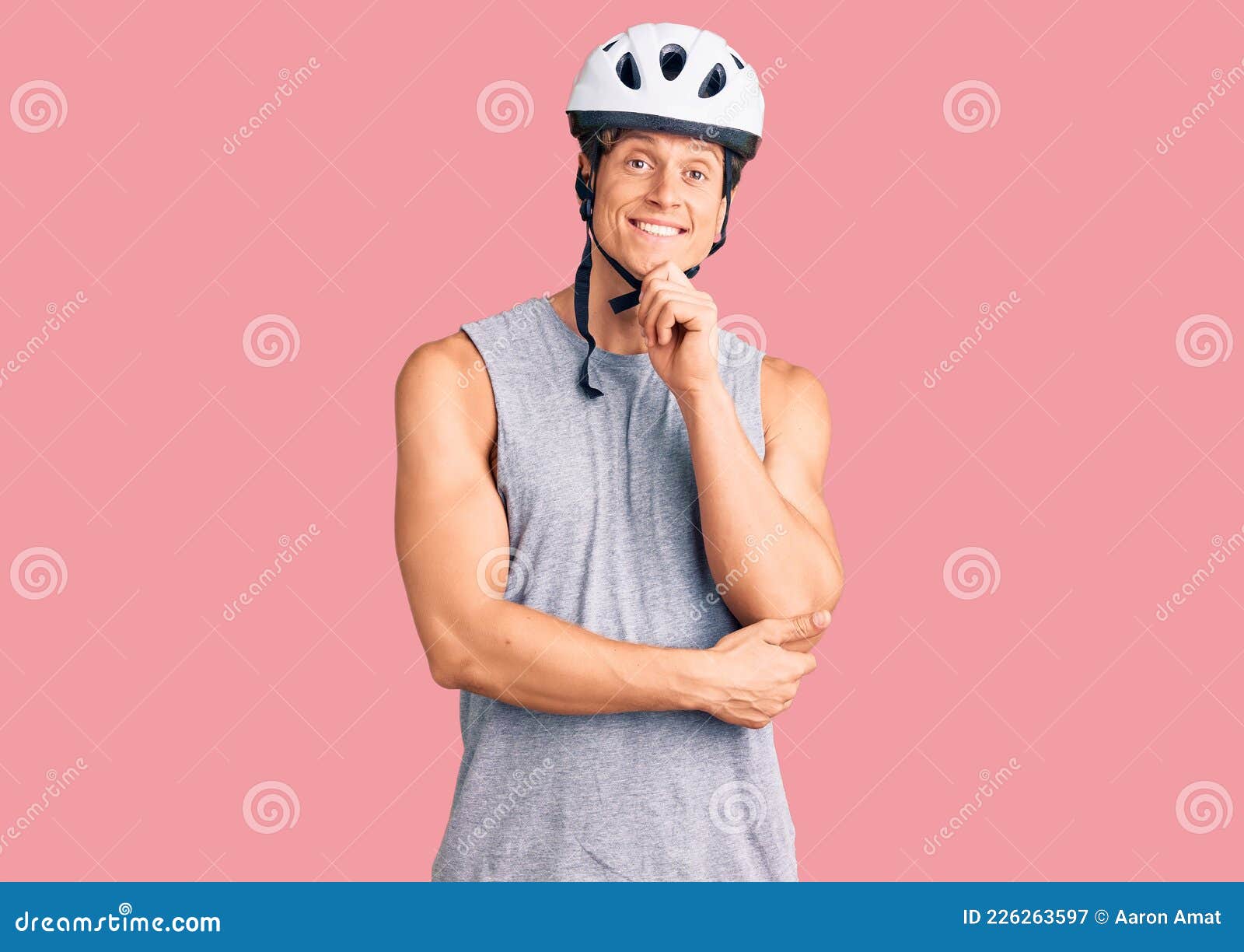 Young Handsome Man Wearing Bike Helmet Looking Confident At The Camera