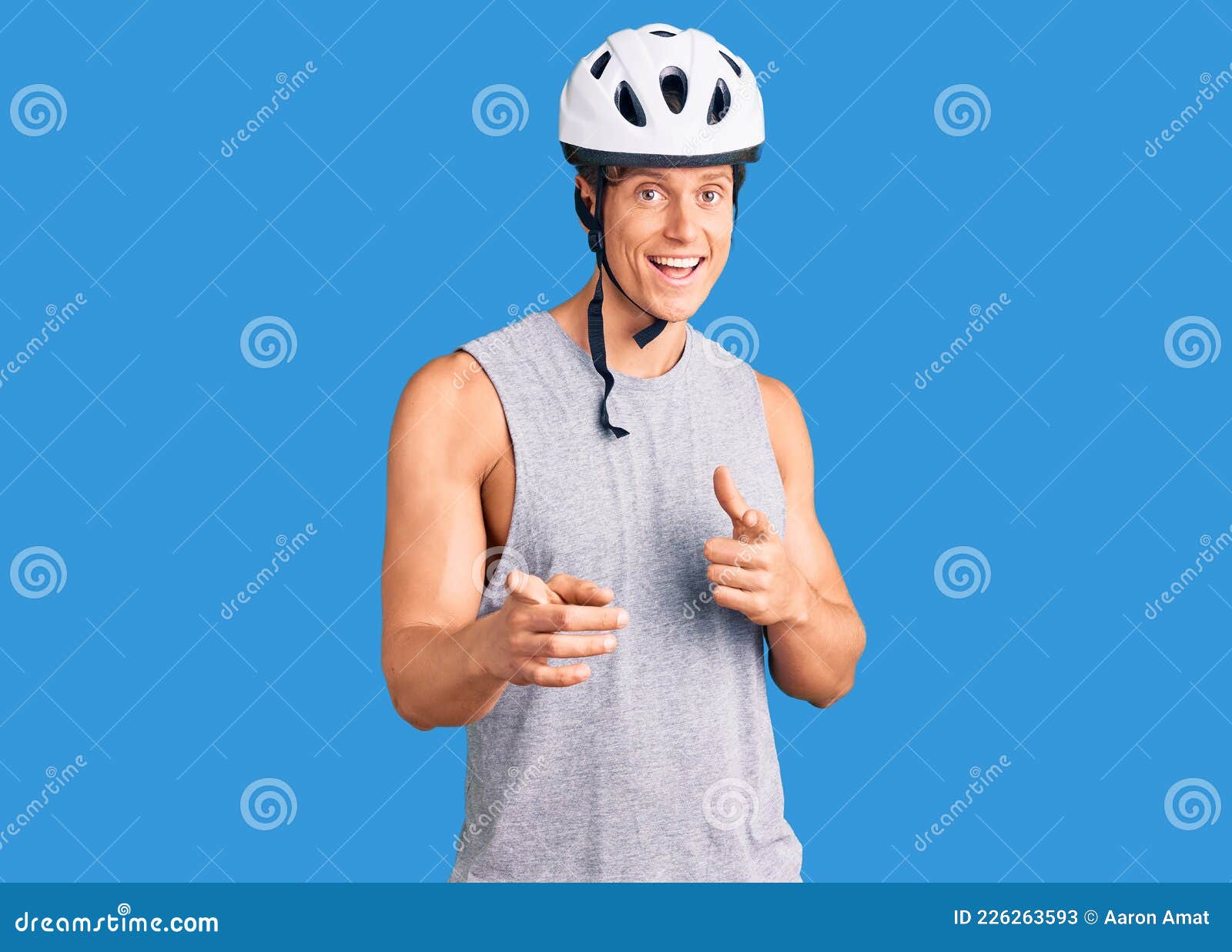 Young Handsome Man Wearing Bike Helmet Pointing Fingers To Camera With