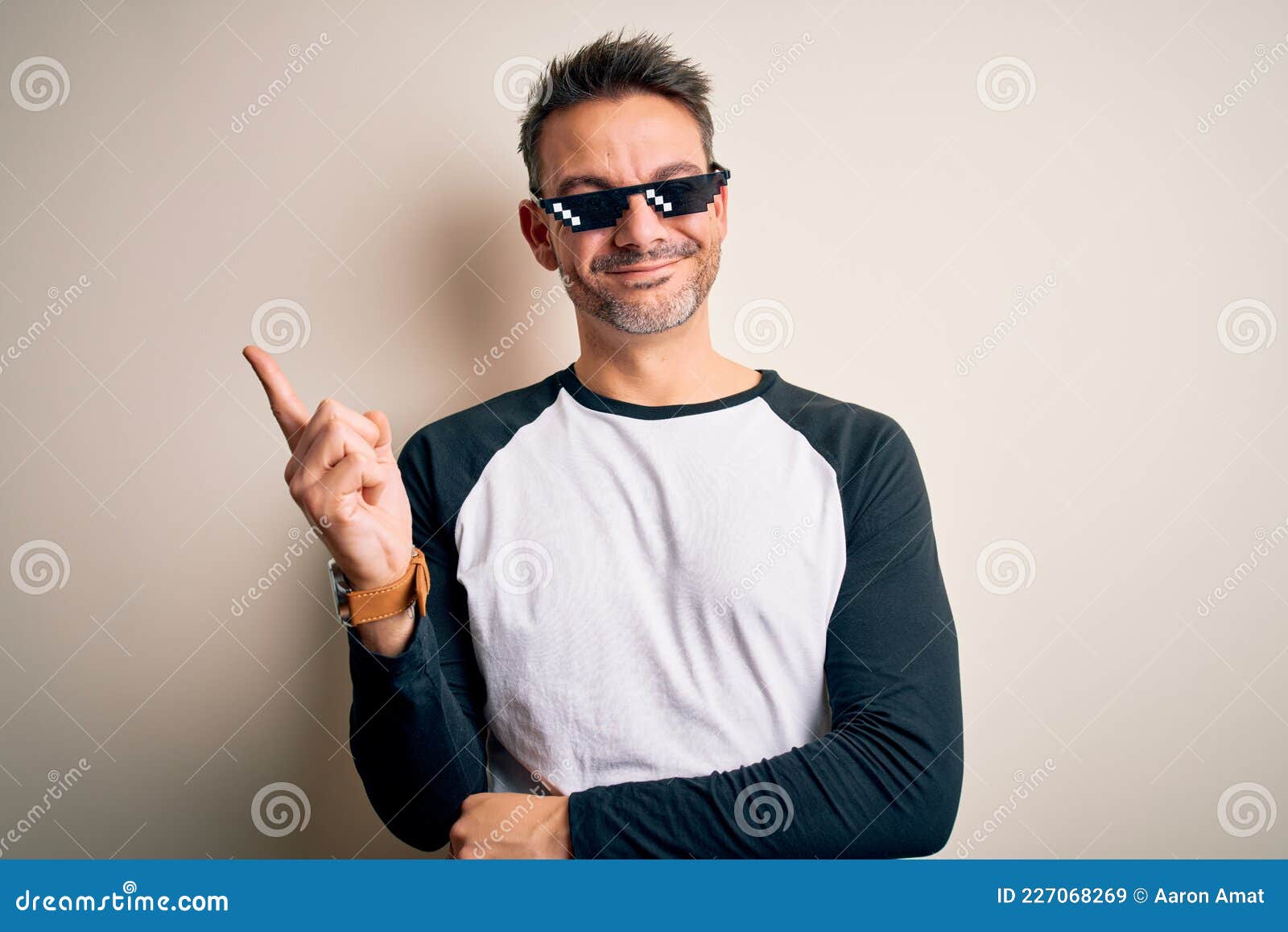 Young Handsome Man Wearing Funny Thug Life Sunglasses Meme Over White