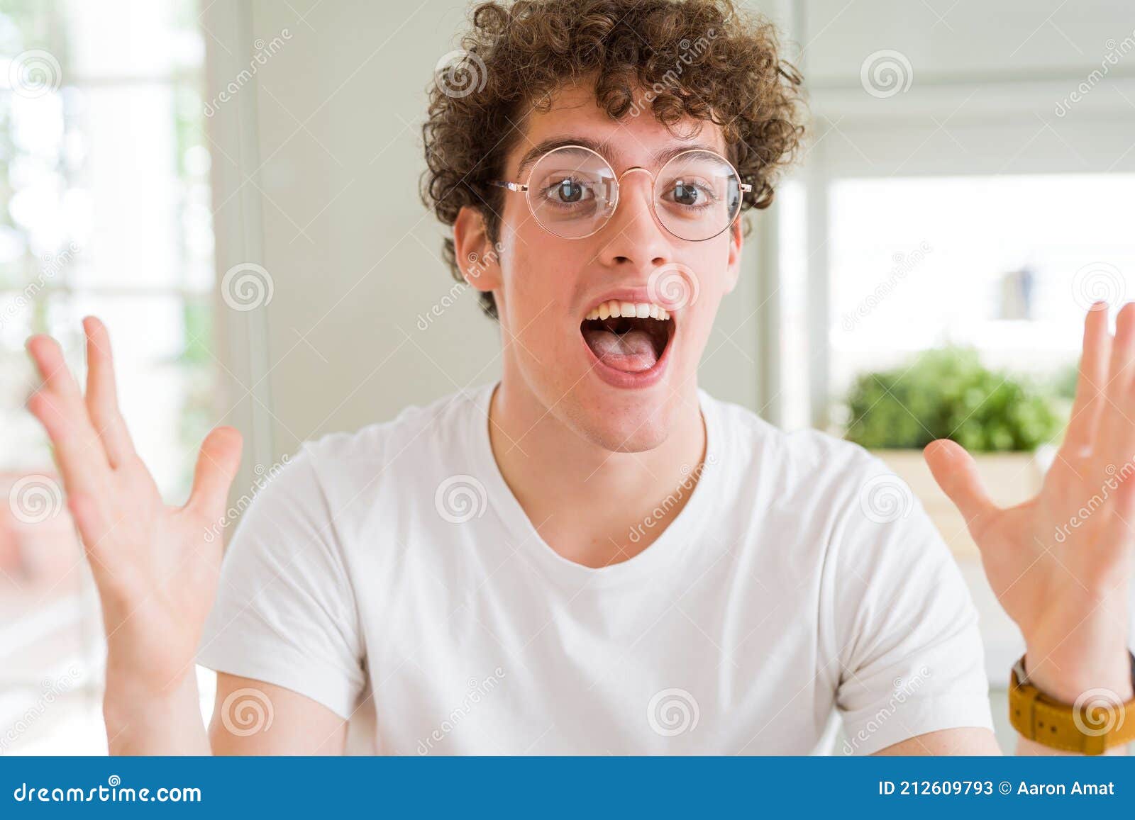 Young Handsome Man Wearing Glasses Celebrating Crazy And Amazed For