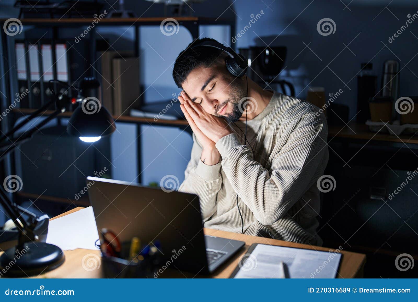 Young Handsome Man Working Using Computer Laptop at Night Sleeping ...