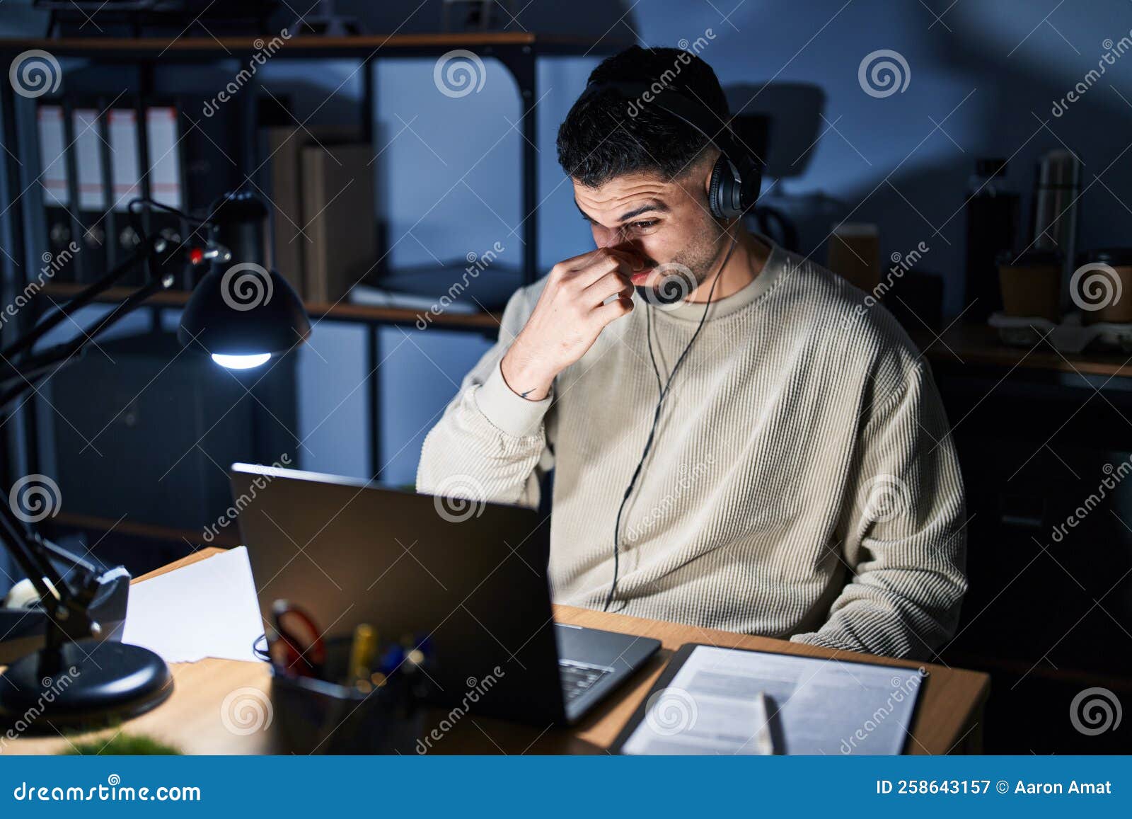 Young Handsome Man Working Using Computer Laptop at Night Smelling ...