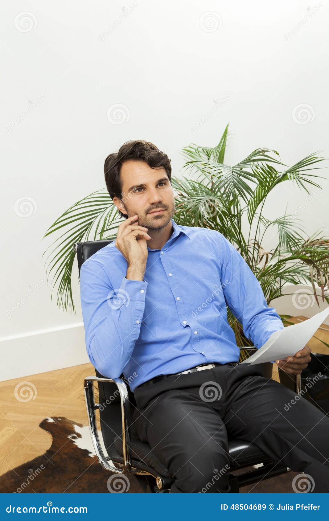 Young Handsome Manager Sitting at His Desk in the Office Stock Image ...