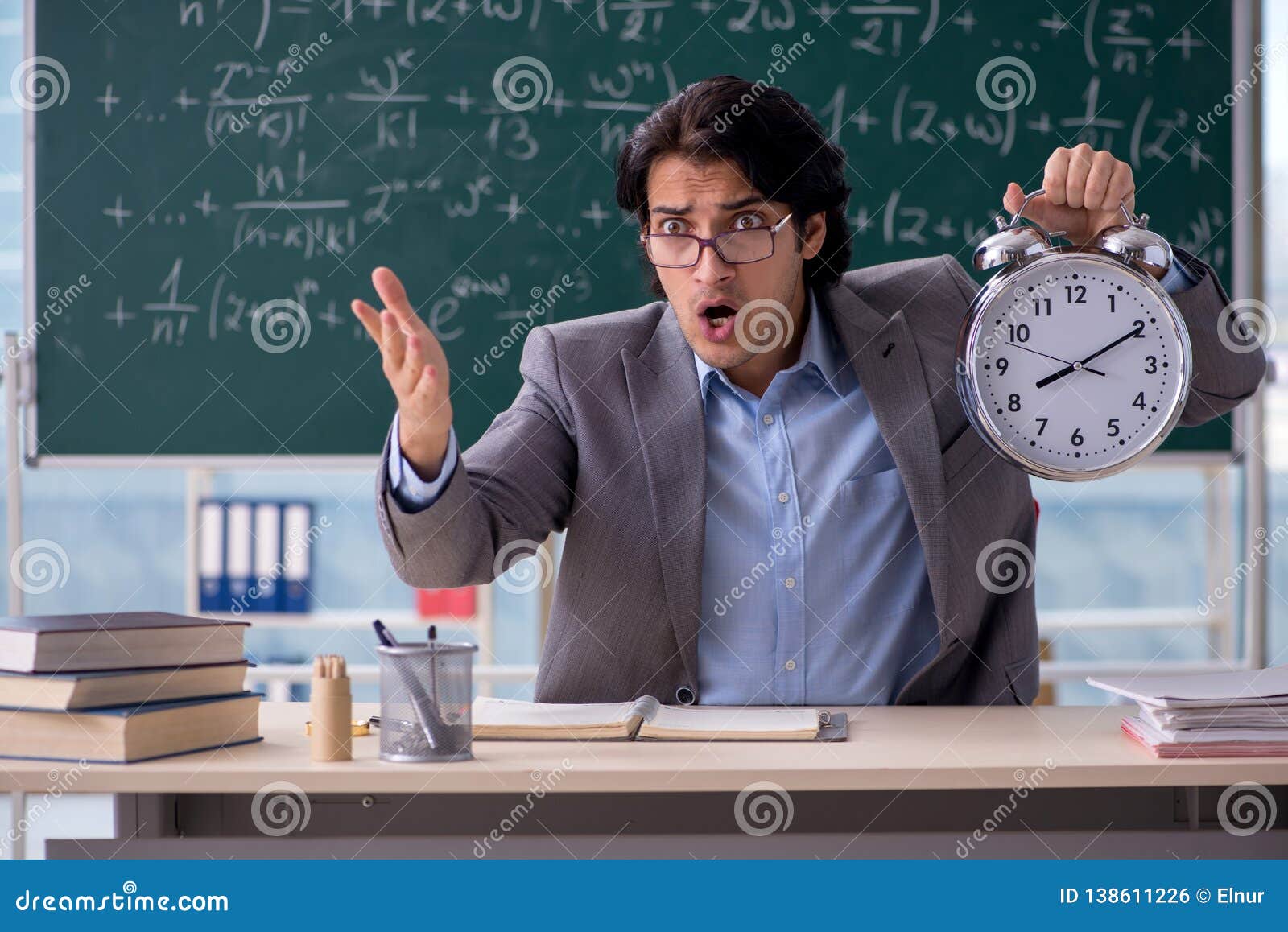 The Young Handsome Math Teacher in Classroom Stock Photo - Image of ...
