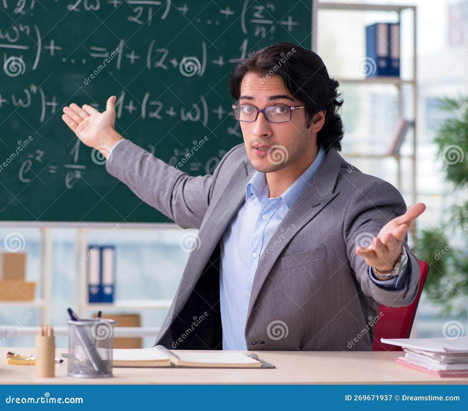 Young Handsome Math Teacher in Classroom Stock Image - Image of ...