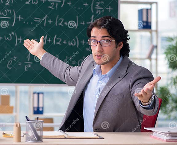 Young Handsome Math Teacher in Classroom Stock Image - Image of ...