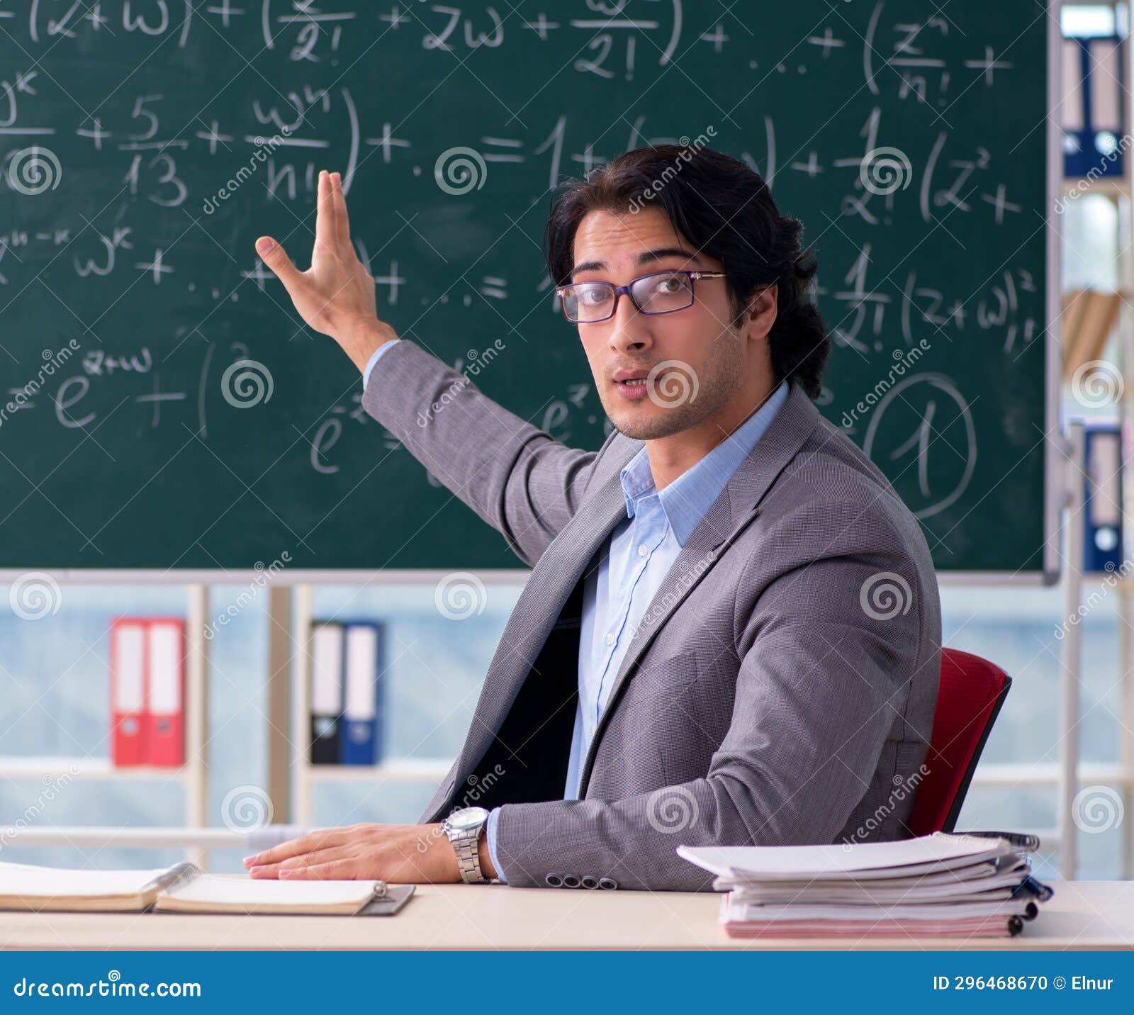 Young Handsome Math Teacher in Classroom Stock Photo - Image of ...