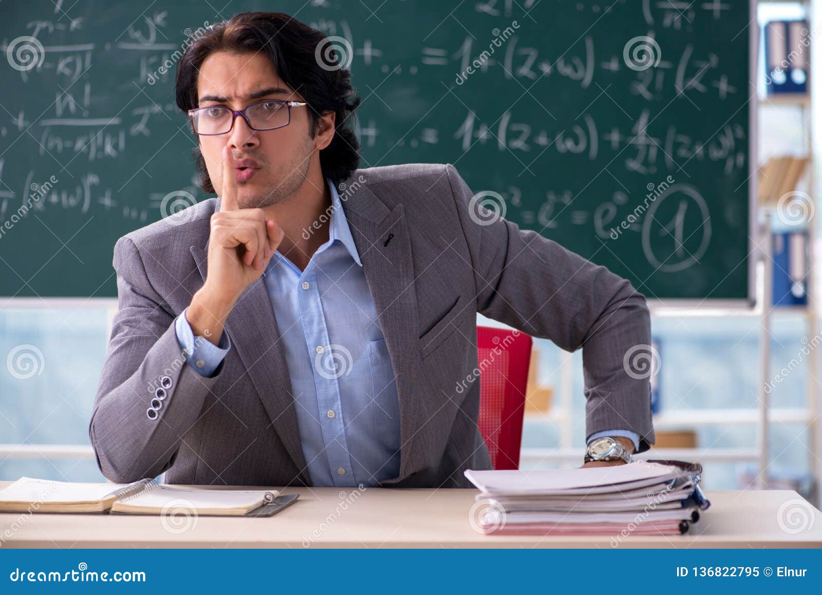The Young Handsome Math Teacher in Classroom Stock Image - Image of ...