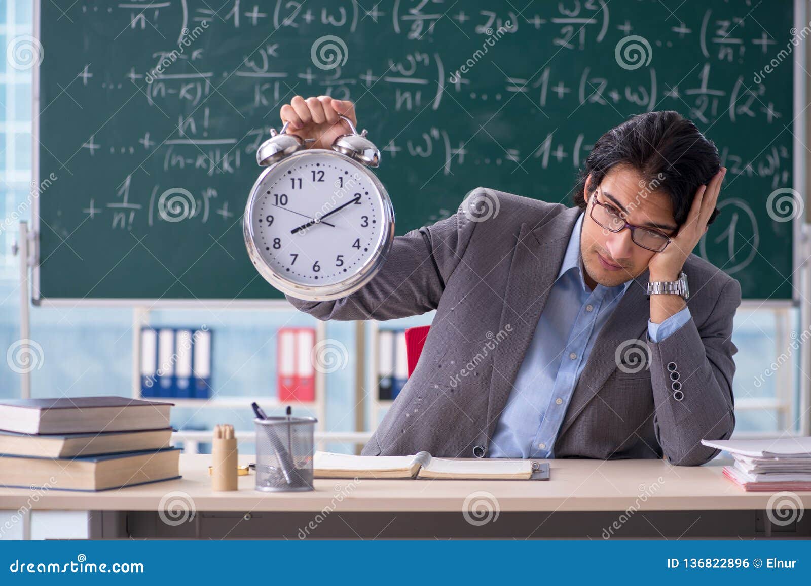 The Young Handsome Math Teacher in Classroom Stock Photo - Image of ...