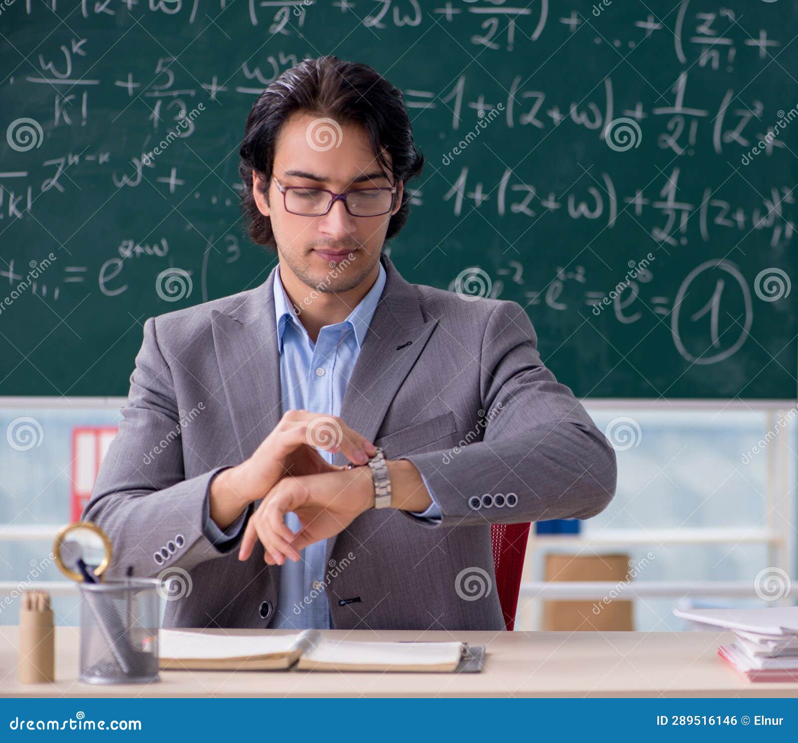 Young Handsome Math Teacher in Classroom Stock Photo - Image of ...