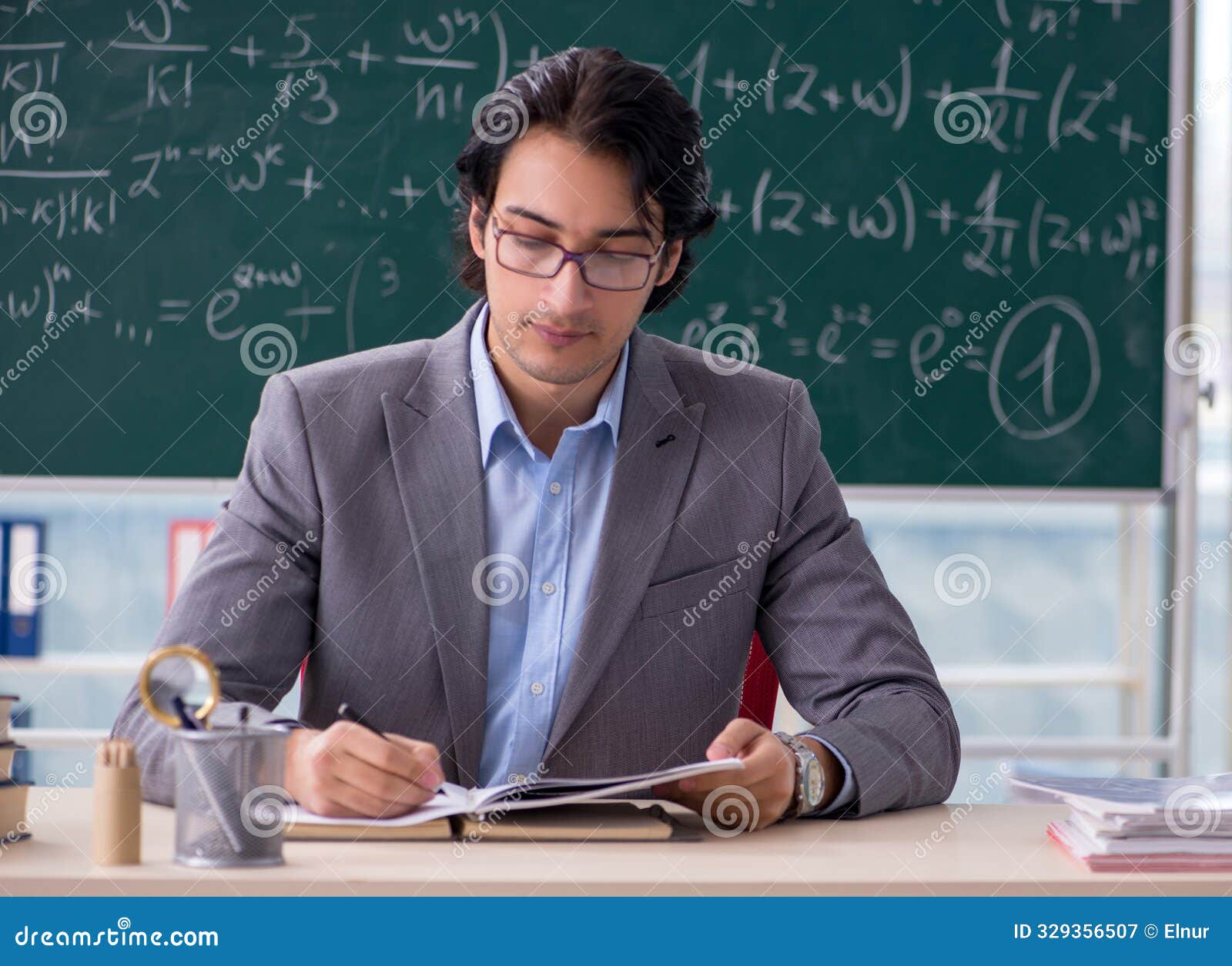 Young Handsome Math Teacher in Classroom Stock Image - Image of ...
