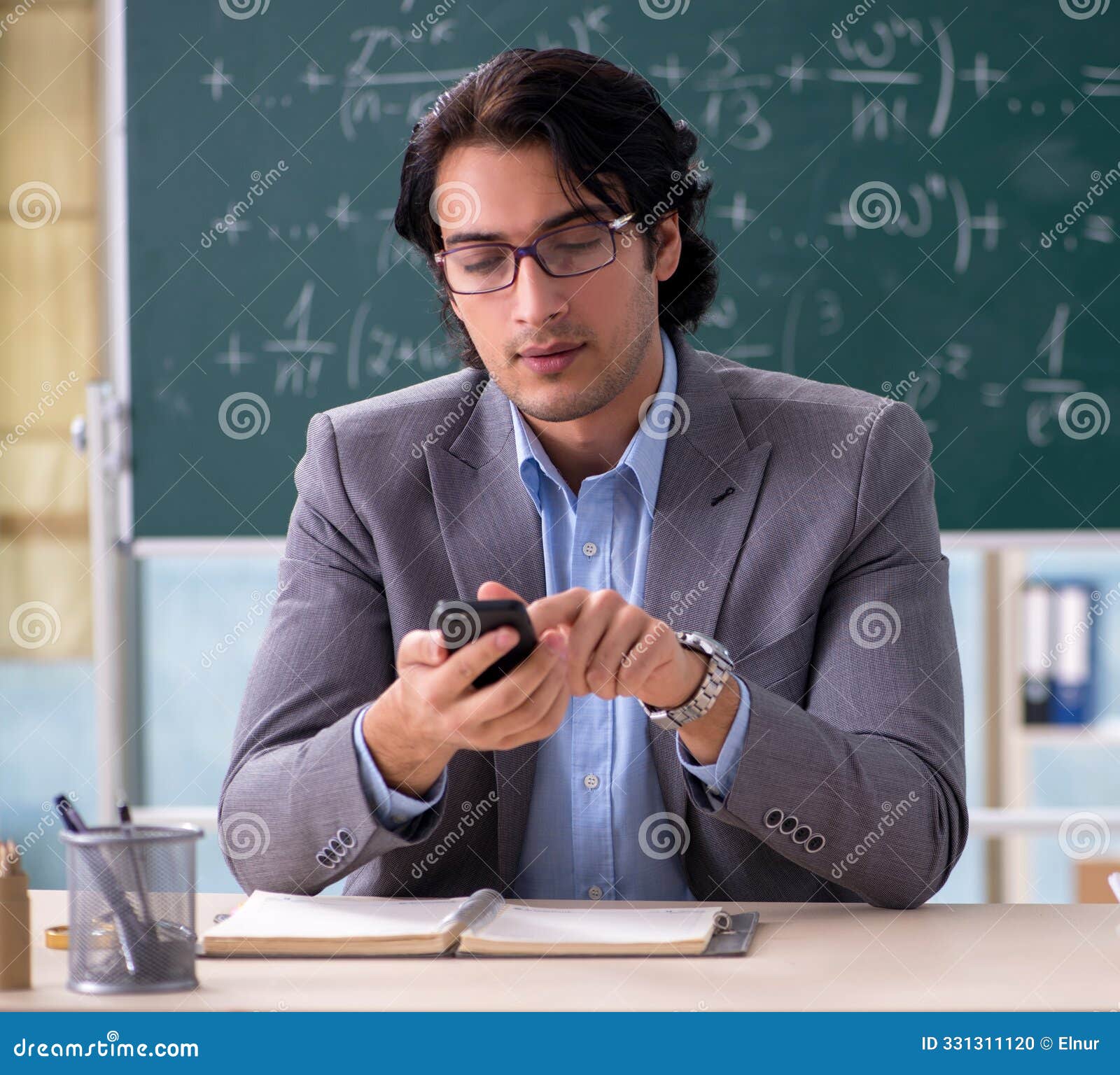 Young Handsome Math Teacher in Classroom Stock Photo - Image of college ...