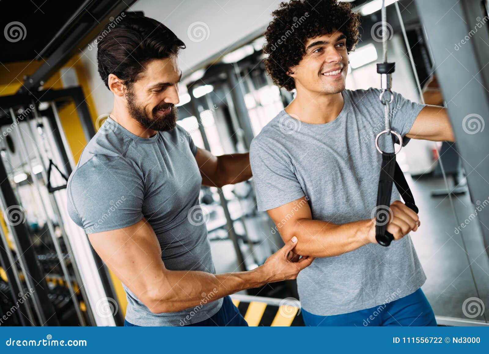 Young Handsome Man Working with Help from Instructor Stock Photo ...