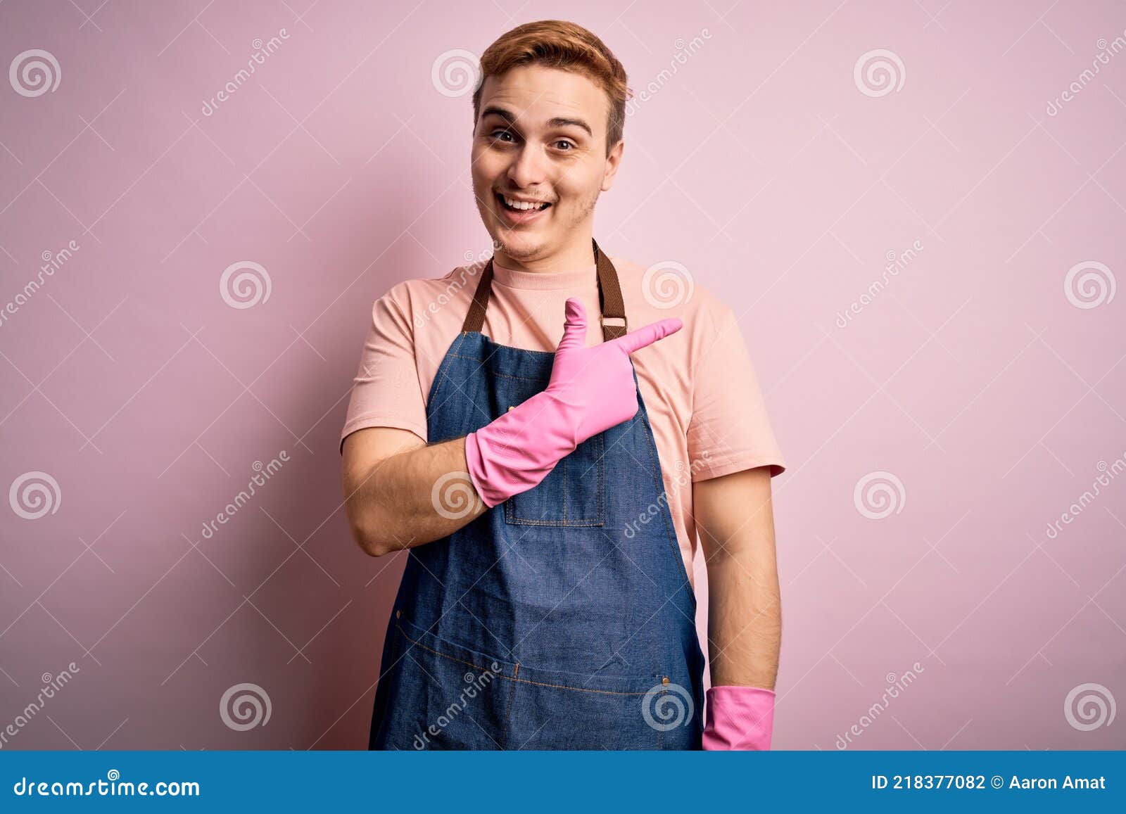 Young Handsome Redhead Cleaner Man Doing Housework Wearing Apron And Gloves Cheerful With A