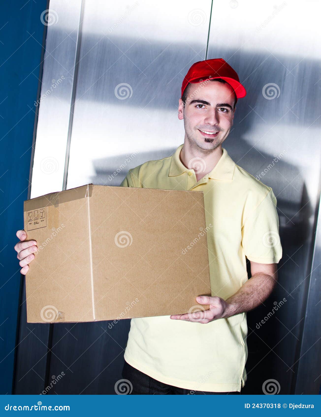 Young Handsome Smiling Delivery Man with Box Stock Photo - Image of ...