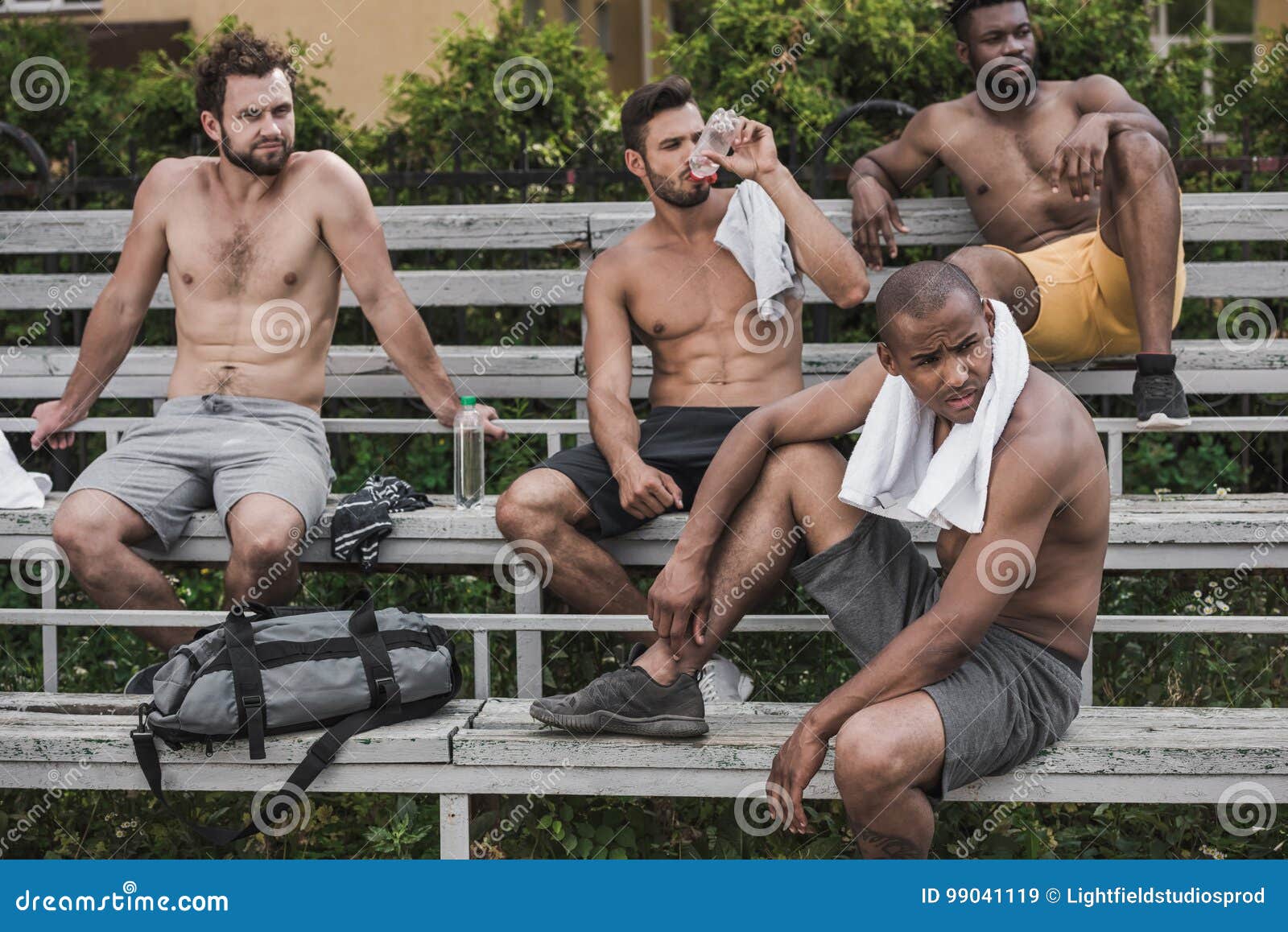Young Handsome Sportsmen Sitting and Resting after Game Stock Image ...