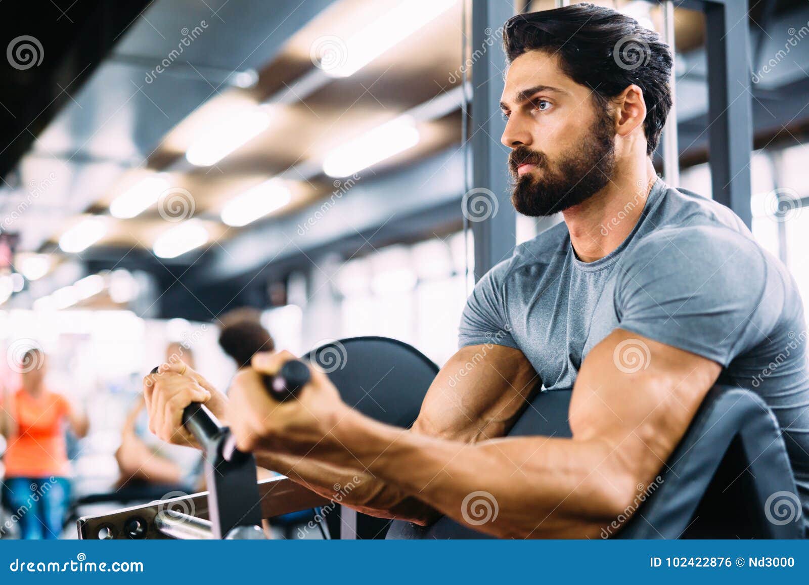 Young Handsome Man Doing Exercises in Gym Stock Photo - Image of ...