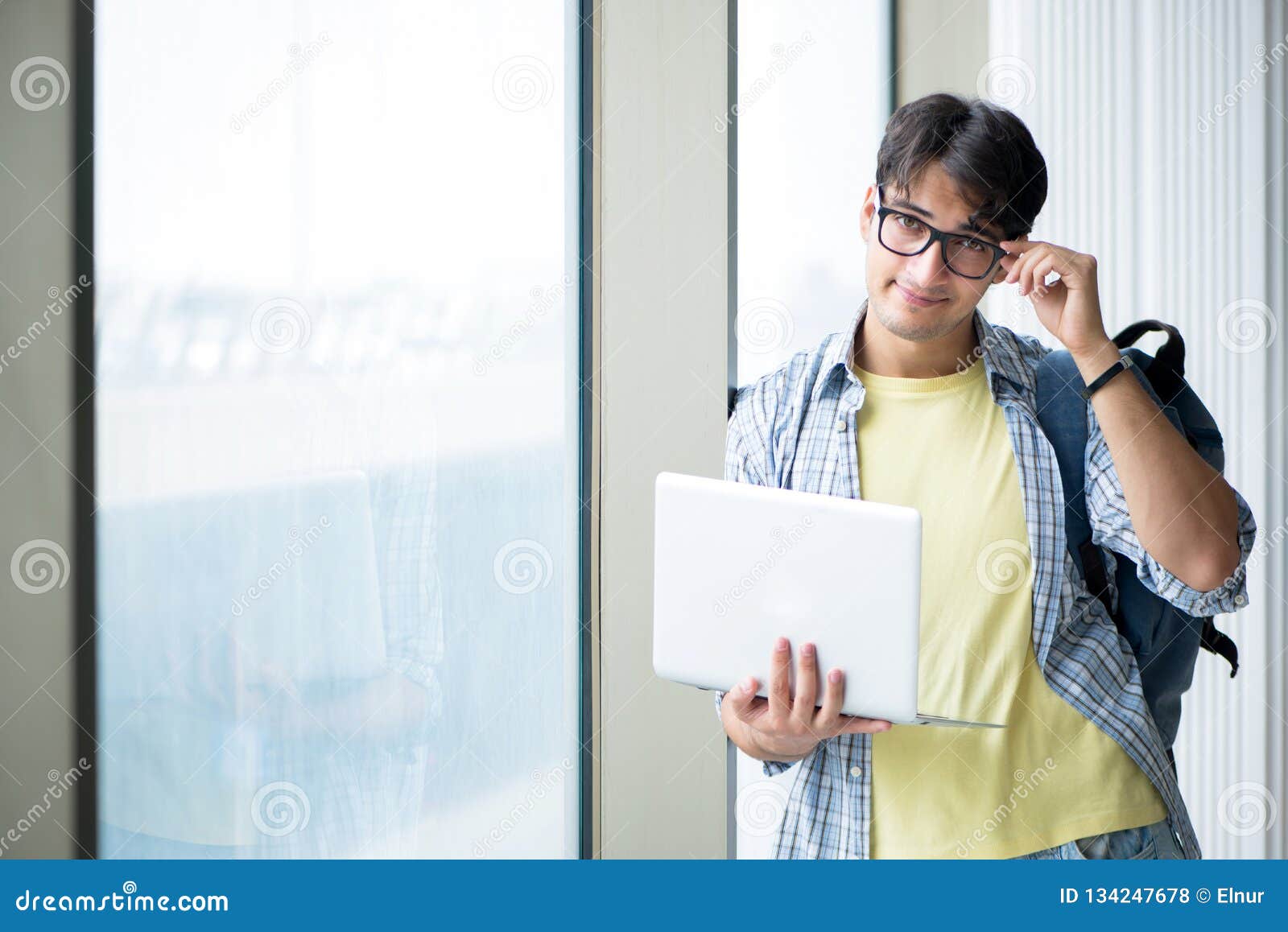 The Young Handsome Student Standing at the Window Stock Photo - Image ...