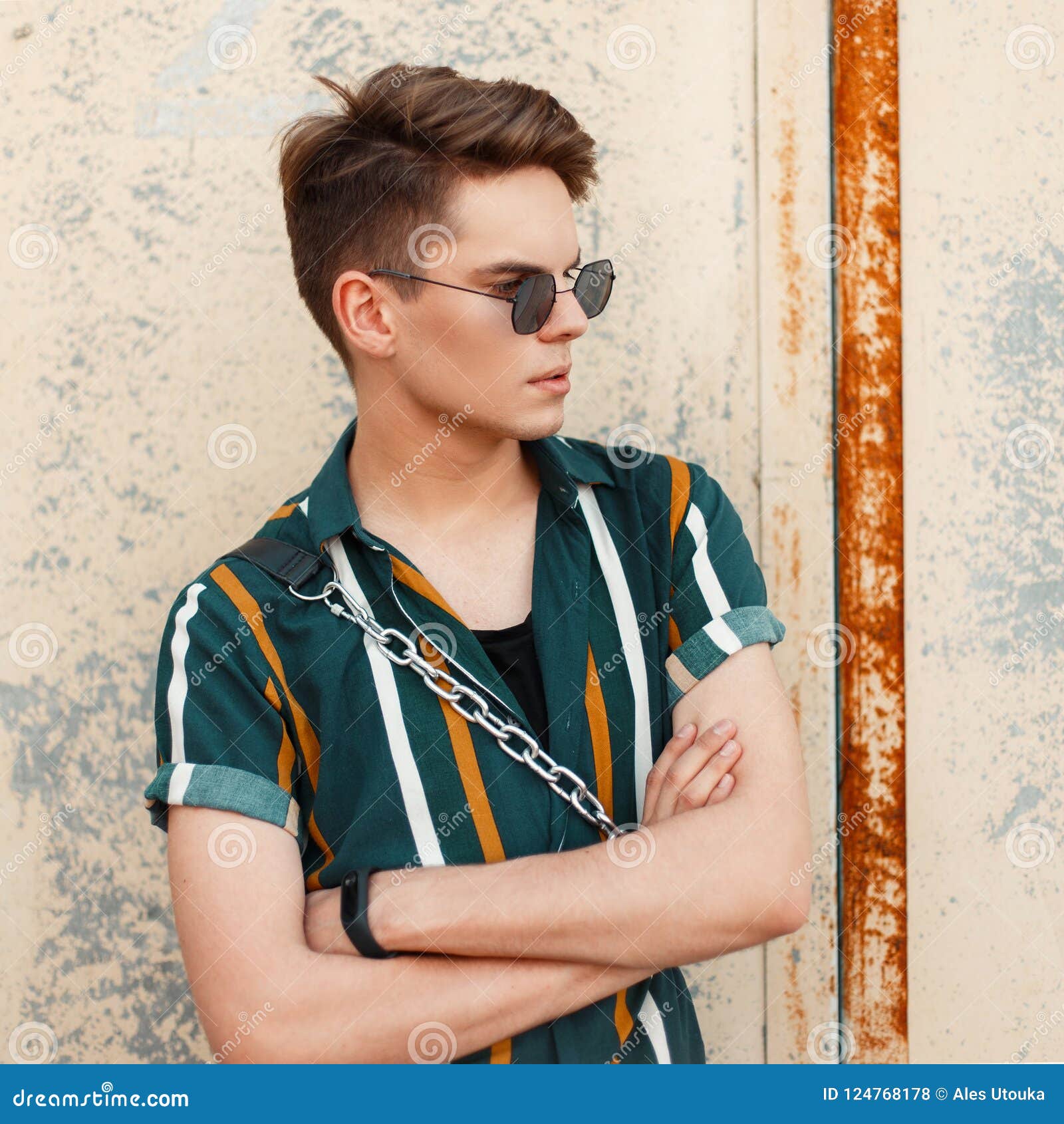 Young Handsome Stylish Guy With Sunglasses Points In Fashionable Stock