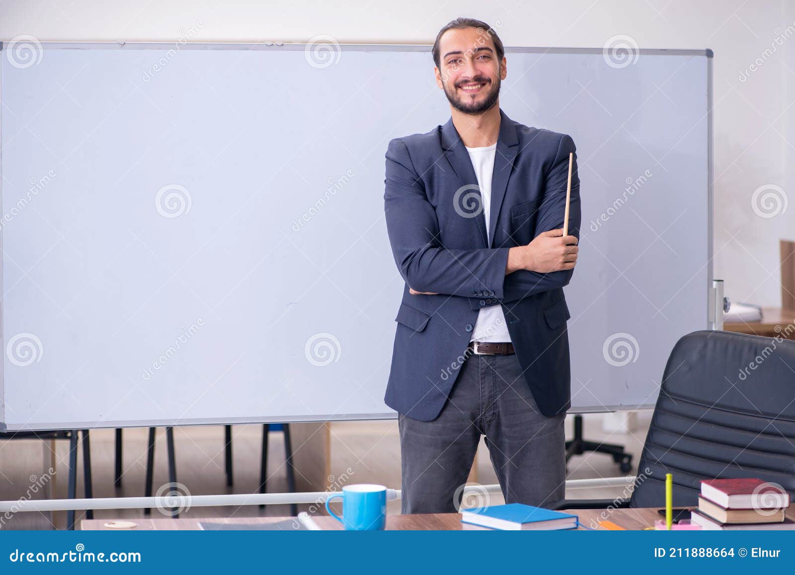 Young Male Teacher in the Classroom Stock Photo - Image of mentoring ...