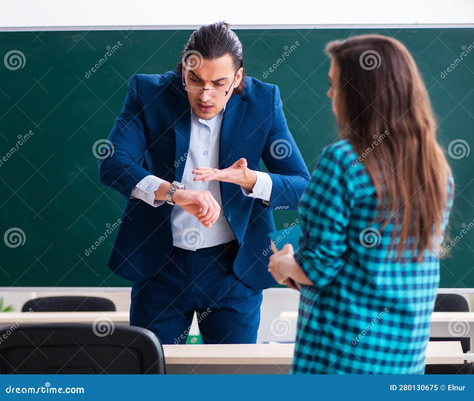 Young Handsome Teacher and Female Student in the Classroom Stock Image ...