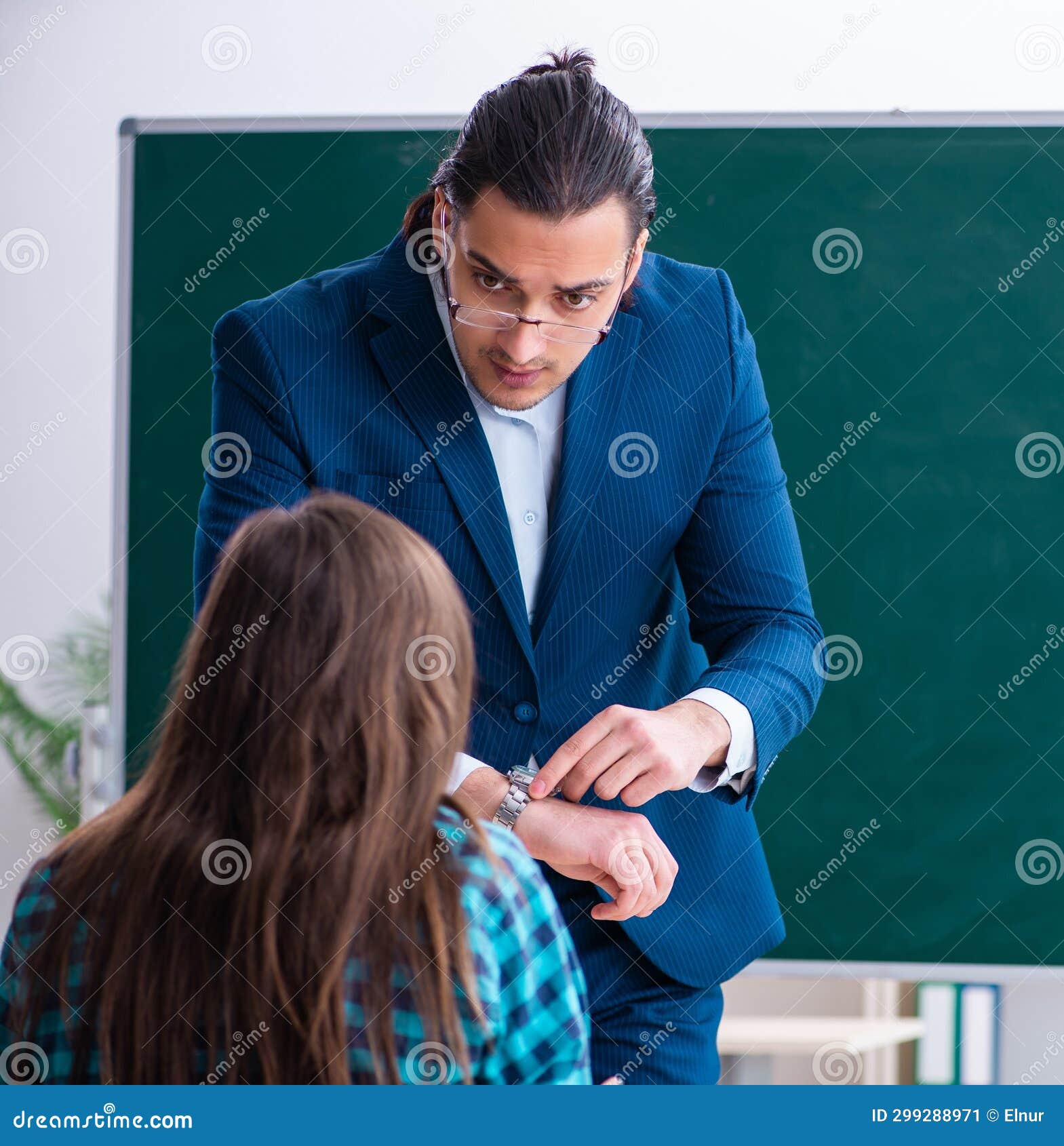 Young Handsome Teacher and Female Student in the Classroom Stock Image ...